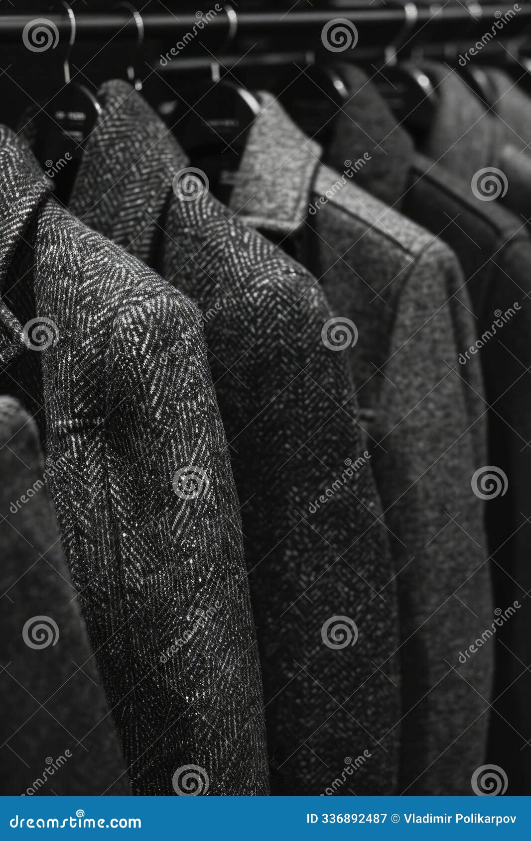 A Row of Suits Hanging on a Rack in a Store or Closet Stock Image ...