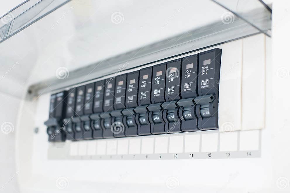 A Row of Switched Off Household Electrical Circuit Breakers on a Wall ...