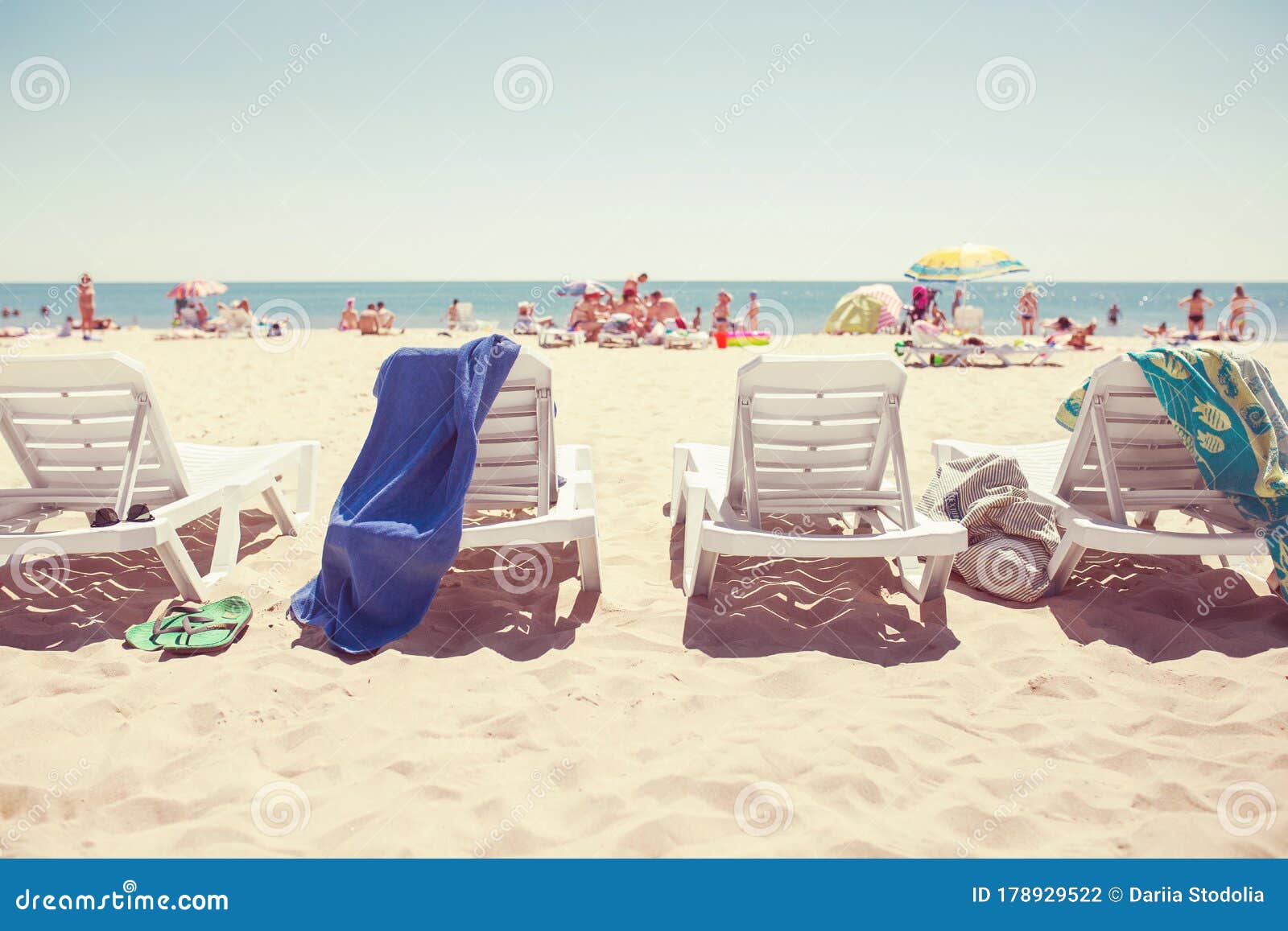 Three Beach Huts With Palm Leaf Covered Roofs On A Wooden Platform Over ...