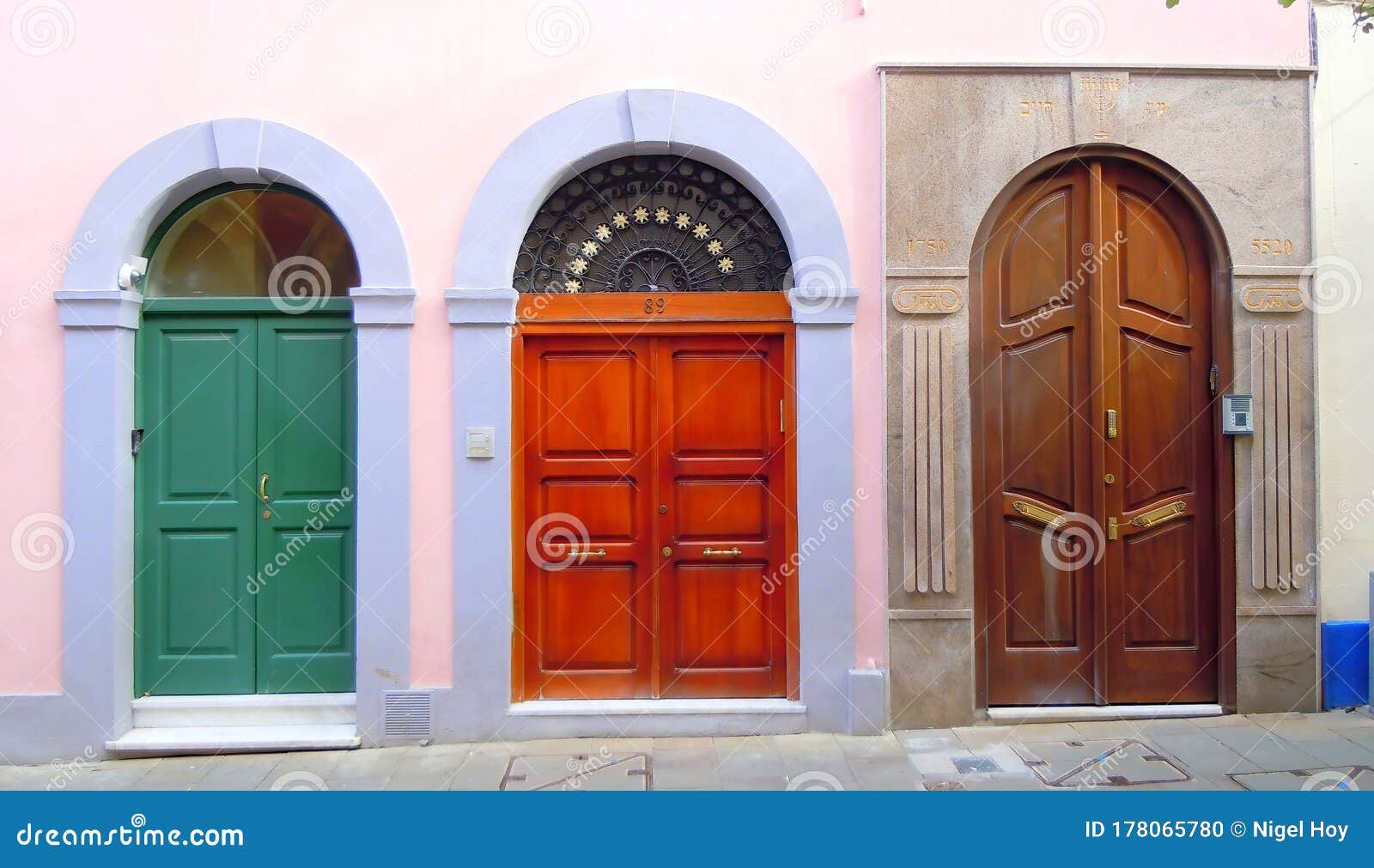 A Row of Three Different Arched Doors Stock Photo - Image of tops ...