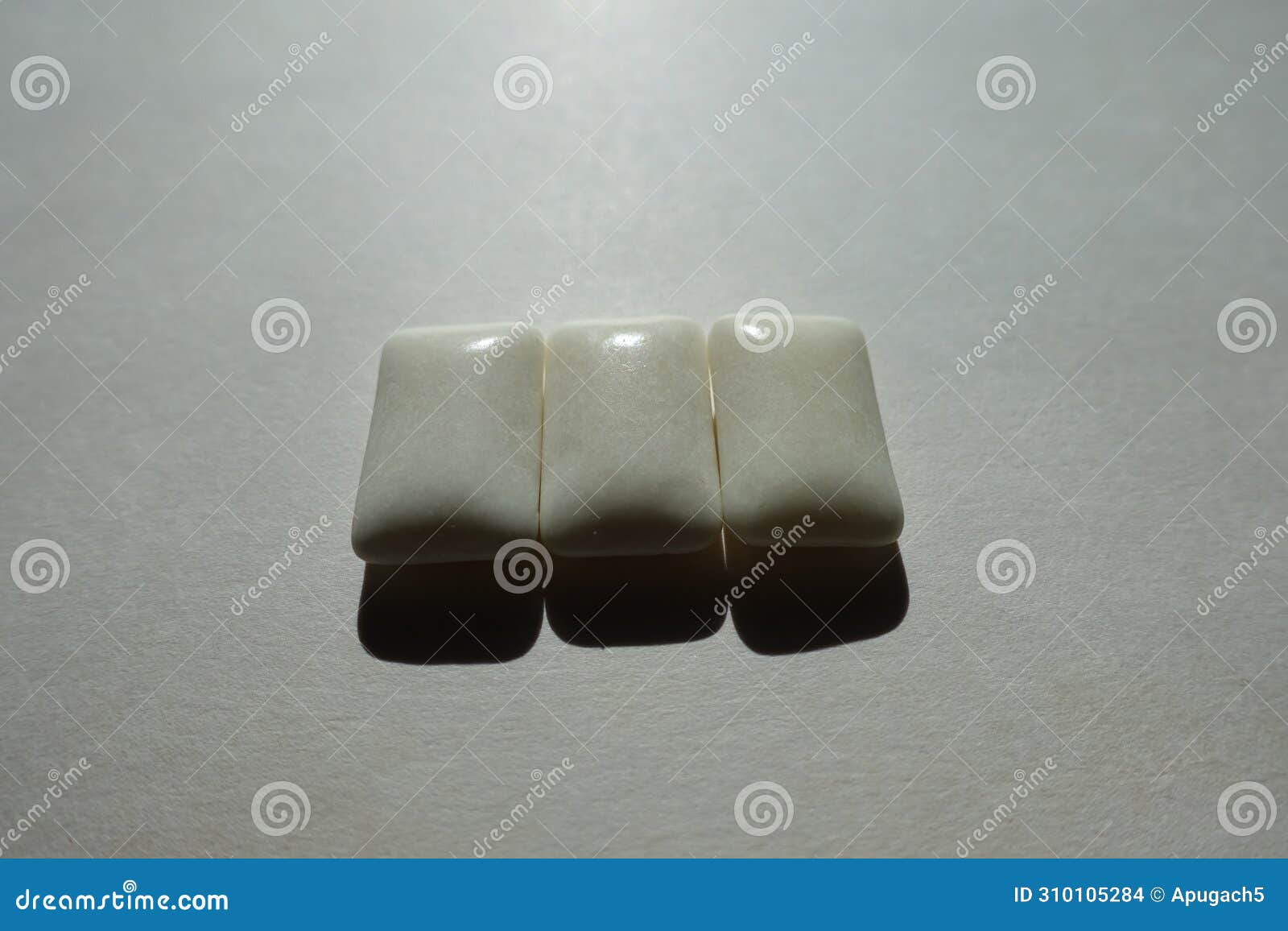 Row of Three White Pieces of Chewing Gum Stock Photo - Image of mouth ...
