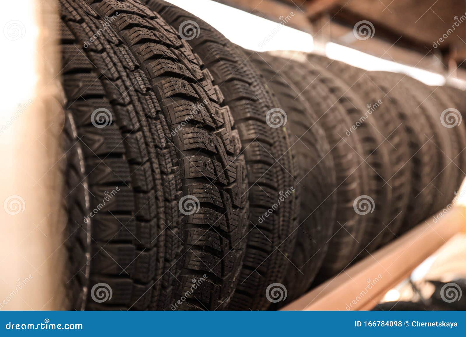 Row of Tires on Rack. Total Wholesale Stock Photo - Image of choice ...