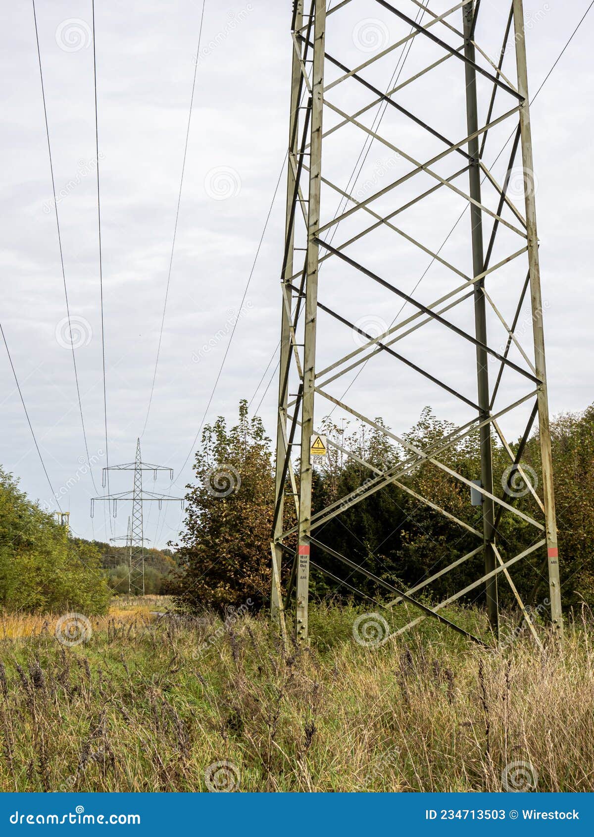 Row of Transmission Towers in the Field Stock Image - Image of lines ...