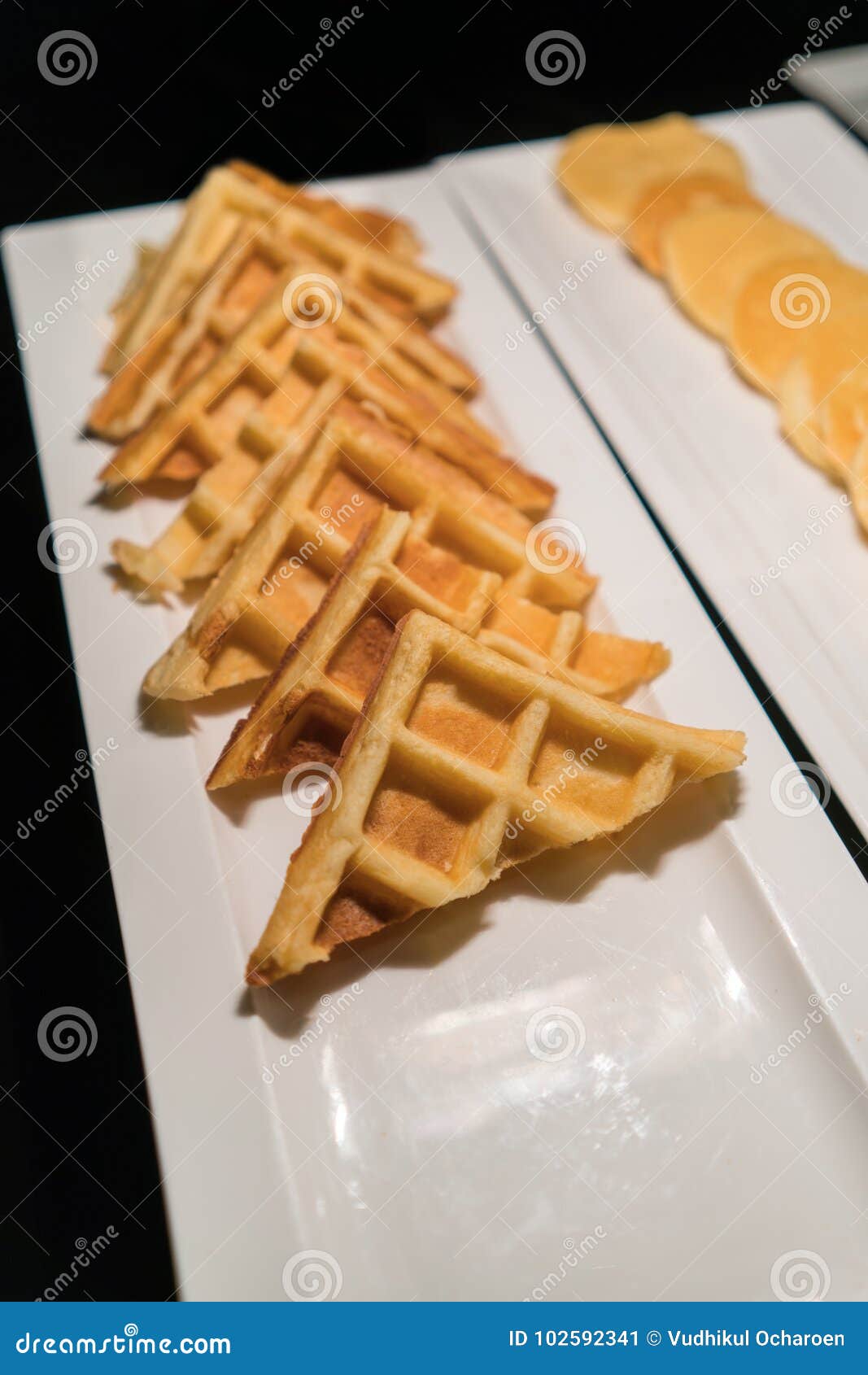 A Row of Triangle Waffles Arranged on Rectangle Platter Stock Image ...