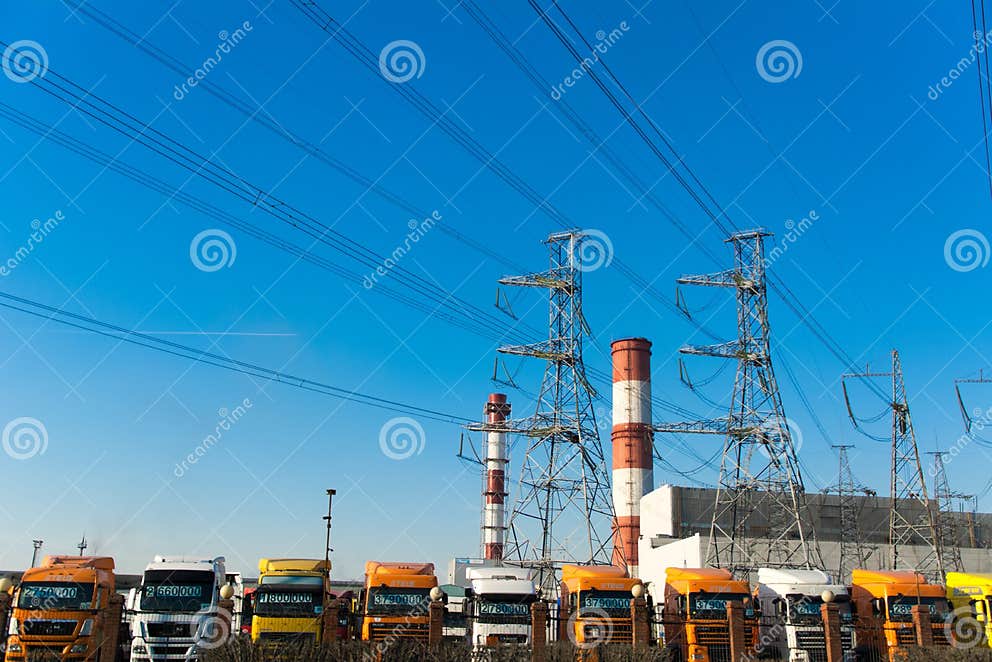Row of Trucks on the Background of the Power Line Editorial Photography ...