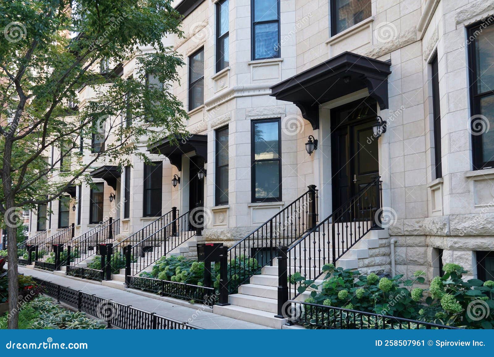 Row of urban townhouses stock image. Image of urban - 258507961