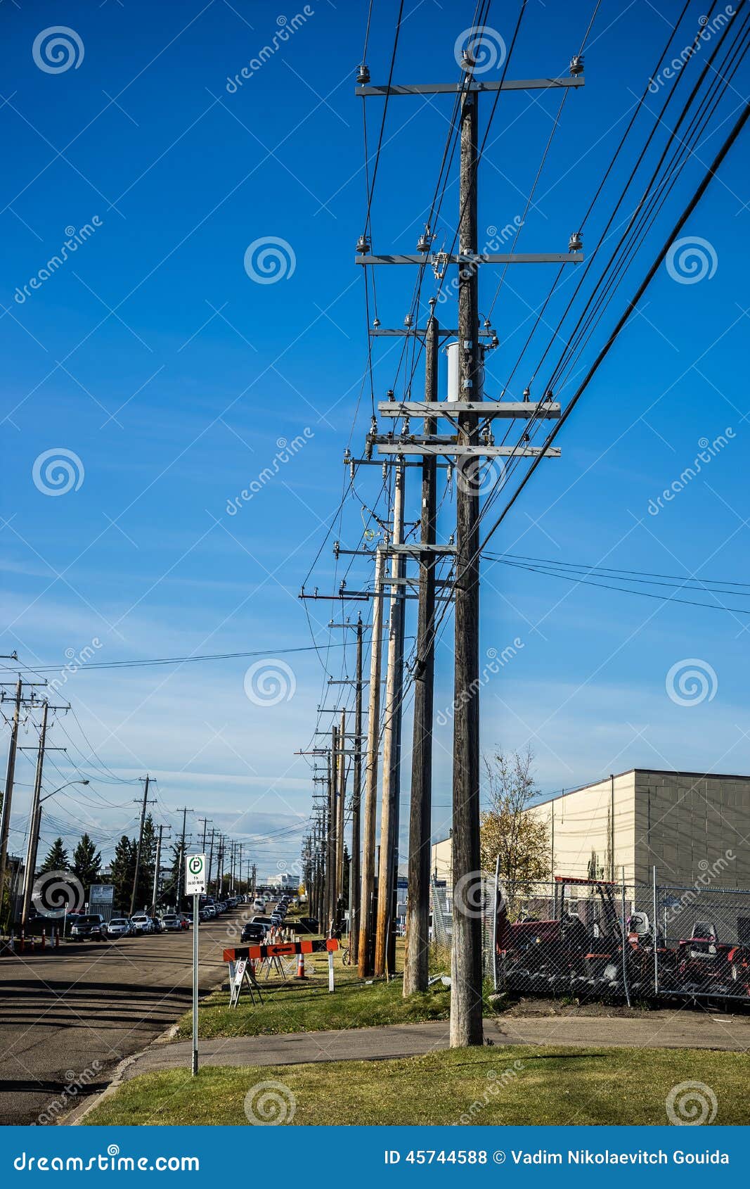 A Row of Utility Power Poles Stock Photo - Image of construction, road ...