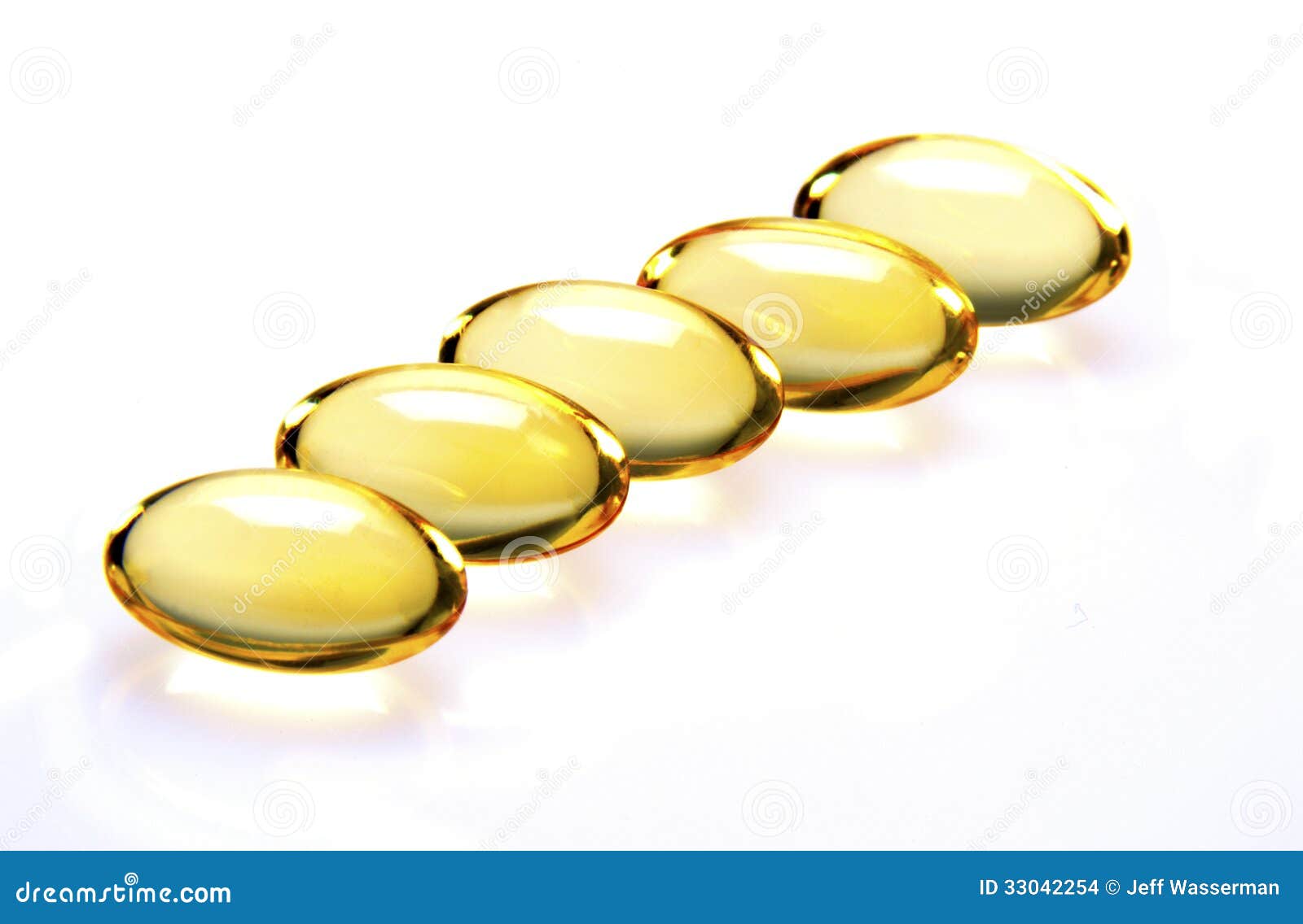 Row of Vitamin E Capsules stock photo. Image of isolated - 33042254
