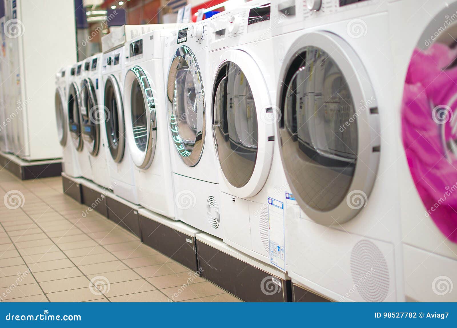 Row of washing machines stock photo. Image of closeup - 98527782