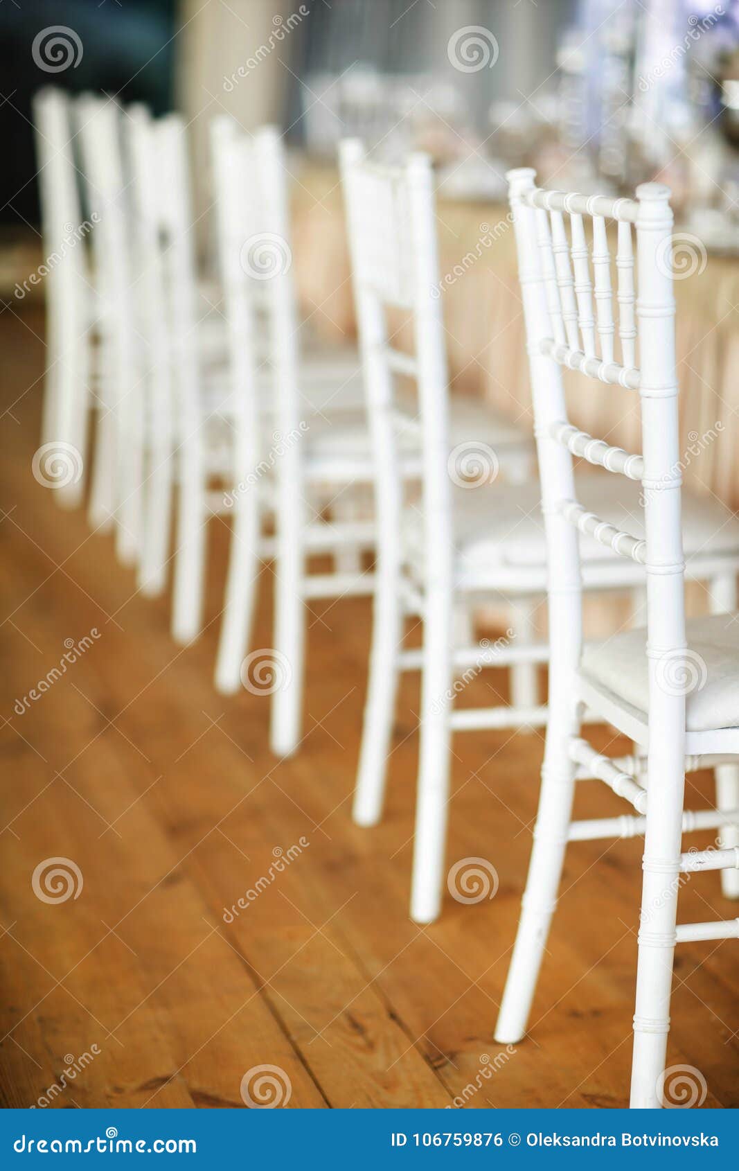 A Row of White Chairs Next To the Wedding Tables Stock Photo - Image of ...