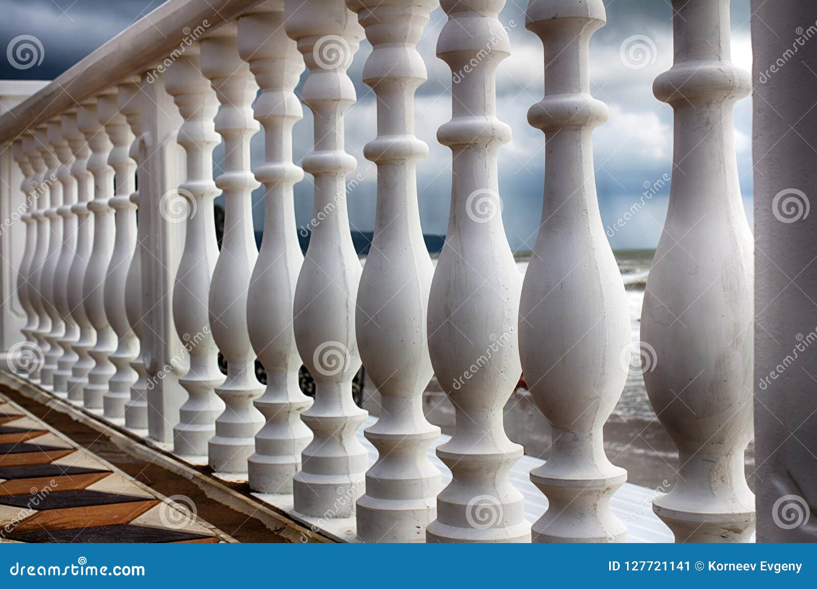 A Row of White Concrete Balusters on the Waterfront Close-up. Stock ...
