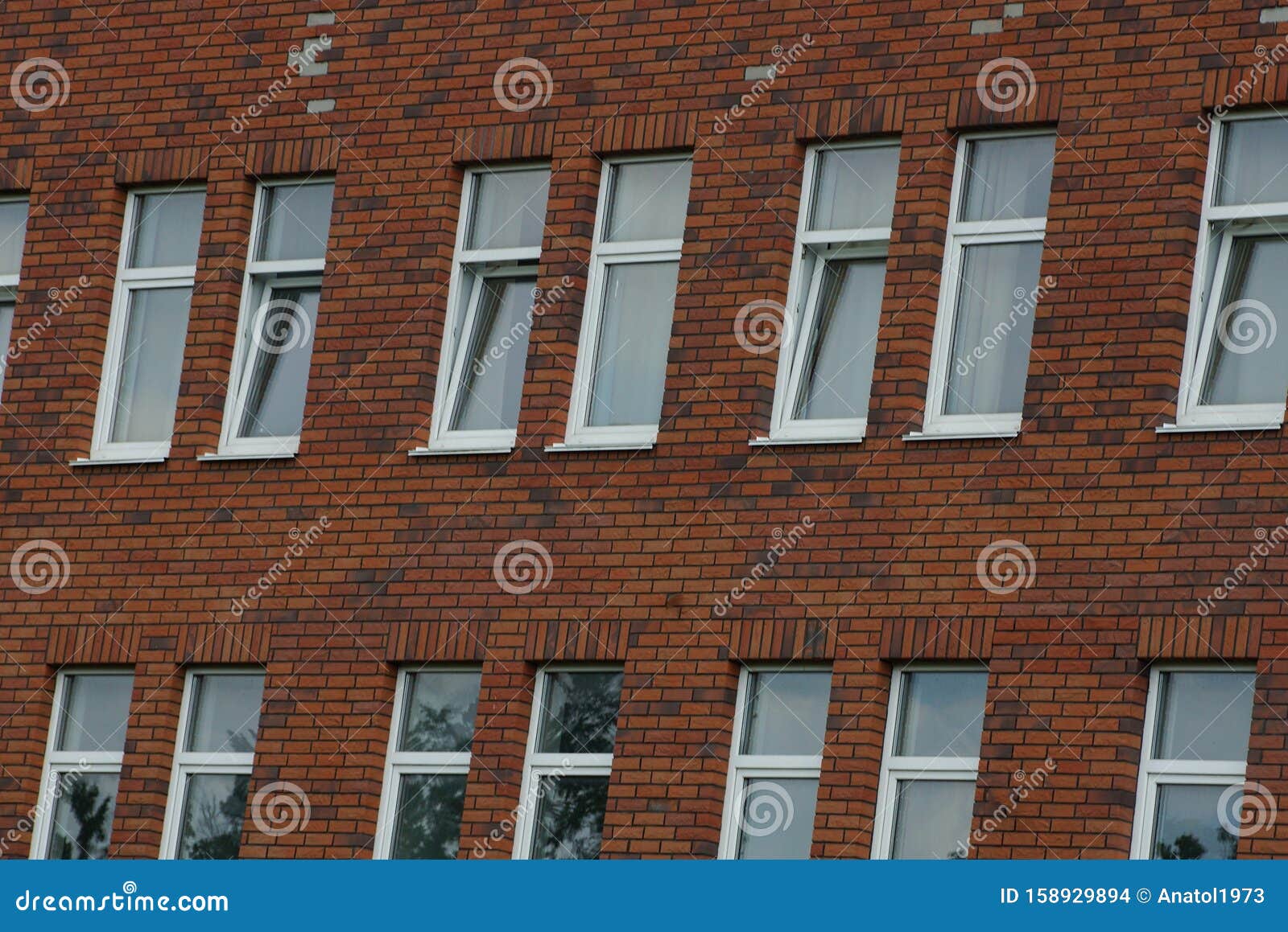 Row of White Windows on a Brown Brick Wall Stock Photo - Image of ...