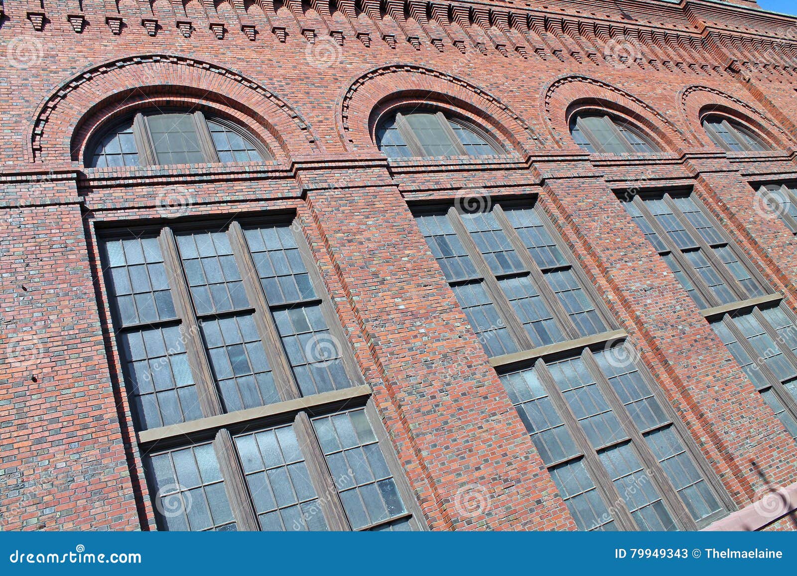 Row of Windows on a Red Brick Building Stock Image - Image of spokane ...
