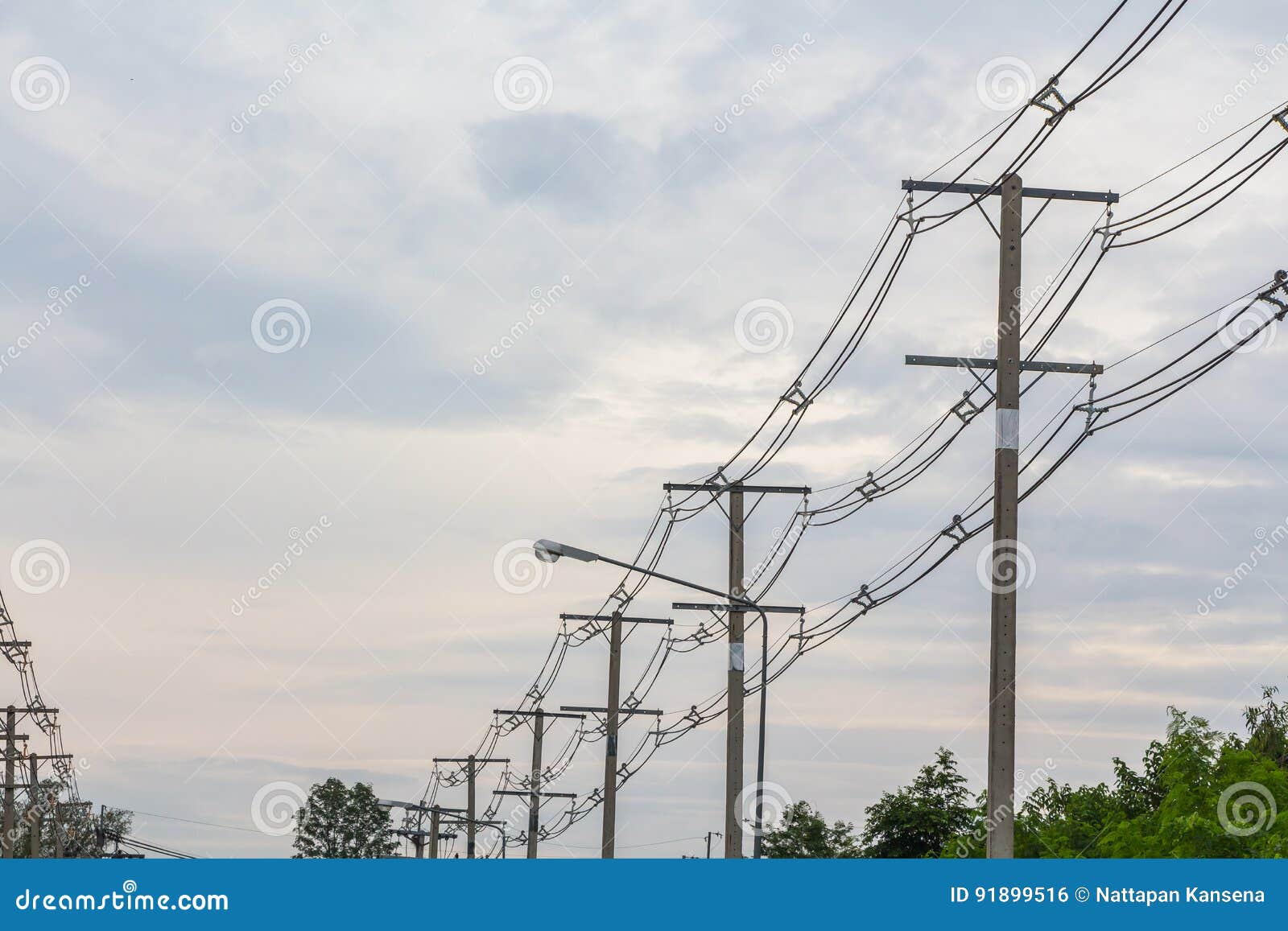 Row of wire electric pole stock photo. Image of network - 91899516