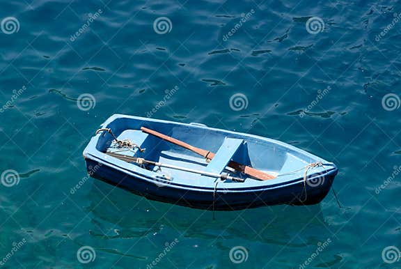 Rowboat stock image. Image of waves, travel, blue, rowboat - 5506835
