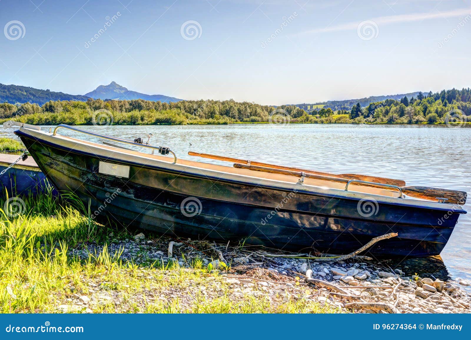 Rowboat at a lake stock photo. Image of allgacurren, lakefront - 96274364