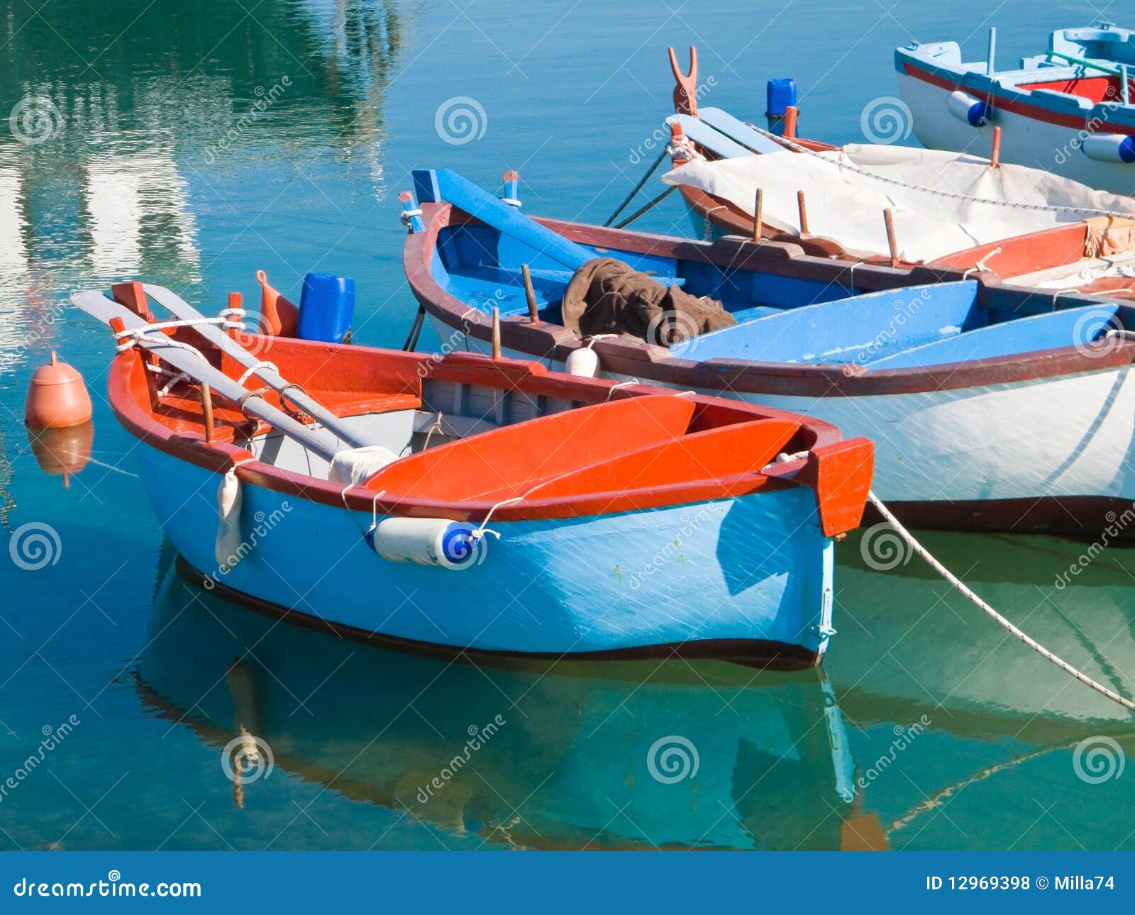 Rowboats in clear sea. stock photo. Image of fishing - 12969398