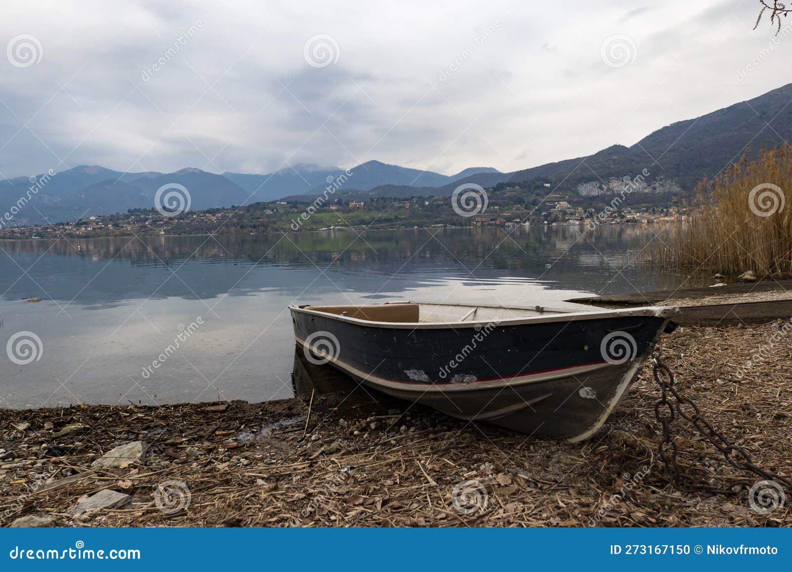 Rowing Boat on the Lakeside of Lake Pusiano Stock Photo - Image of pier ...