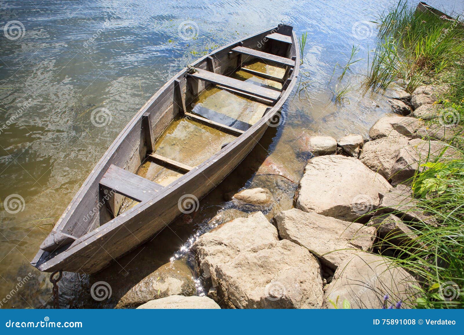 Rowing boat by stone shore stock photo. Image of broken - 75891008