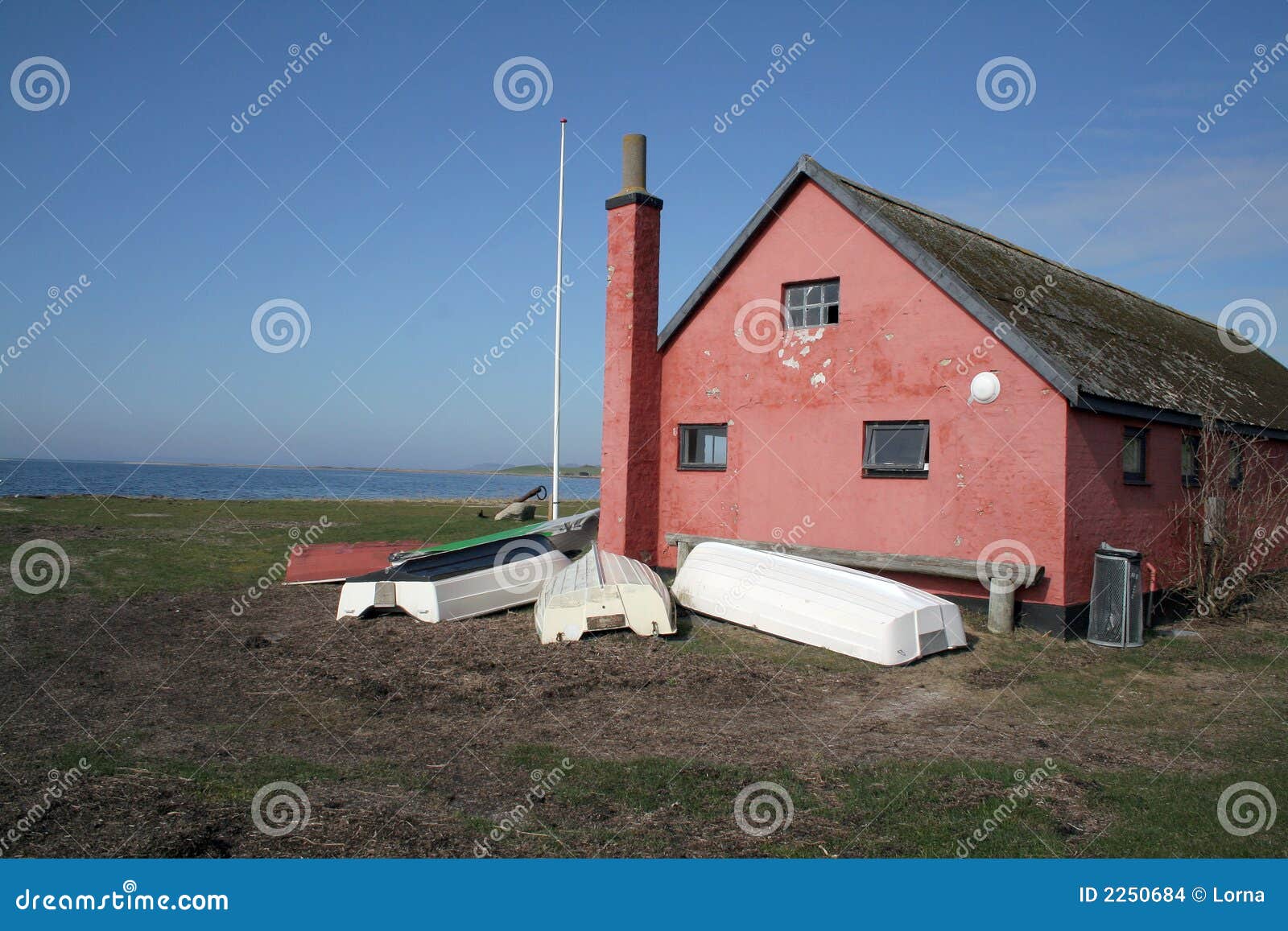 Rowing boats by red house stock photo. Image of side, leisure - 2250684