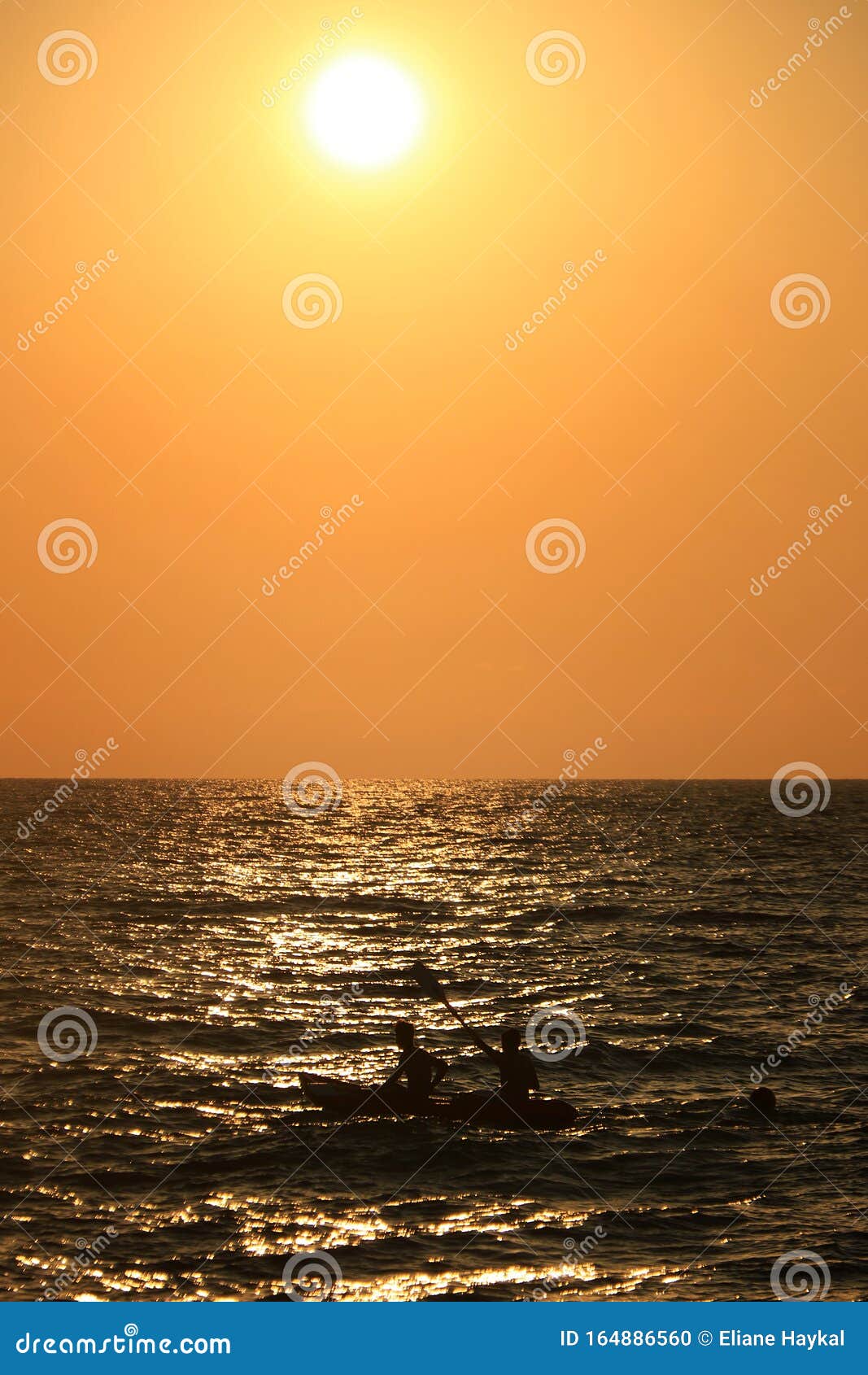 Rowing into Sunset stock photo. Image of nature, activity - 164886560