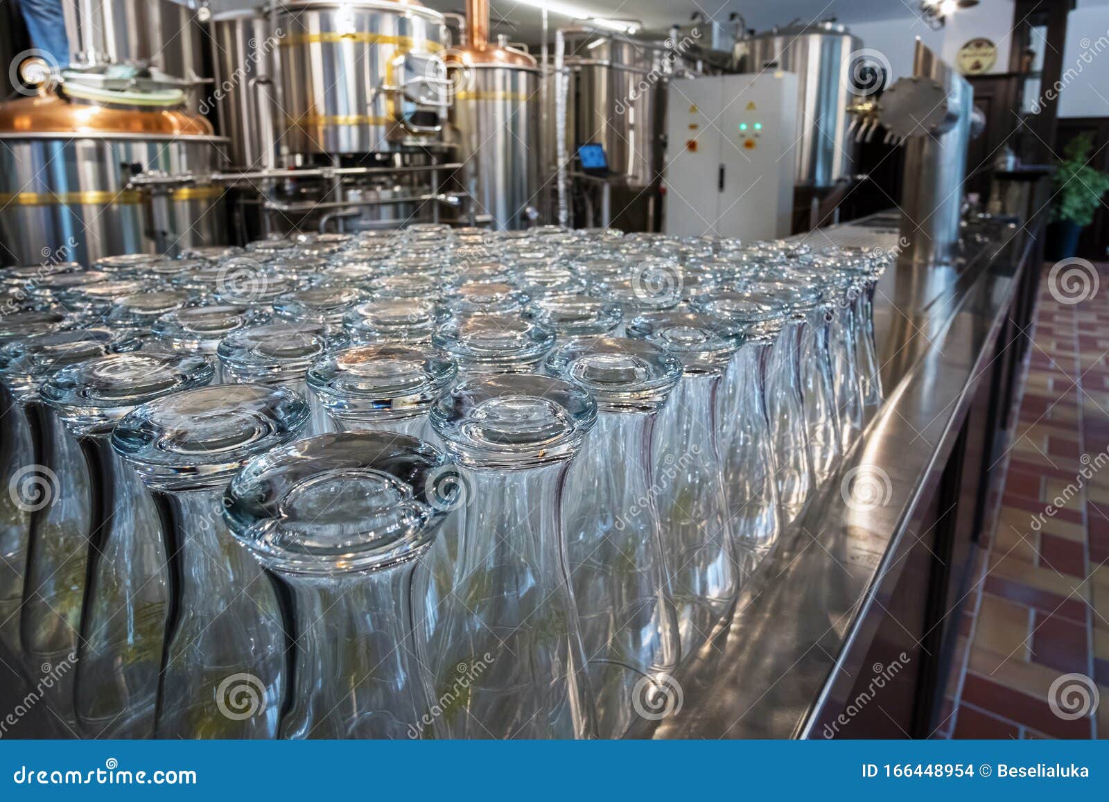 Rows of beer empty glasses stock photo. Image of iron - 166448954
