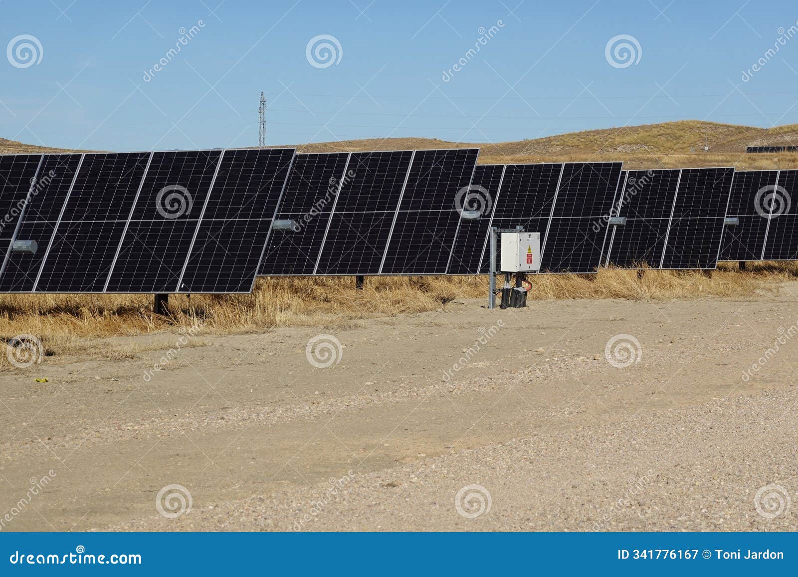 Rows of Black Solar Panels in a Dry, Desert-like Environment, with an ...