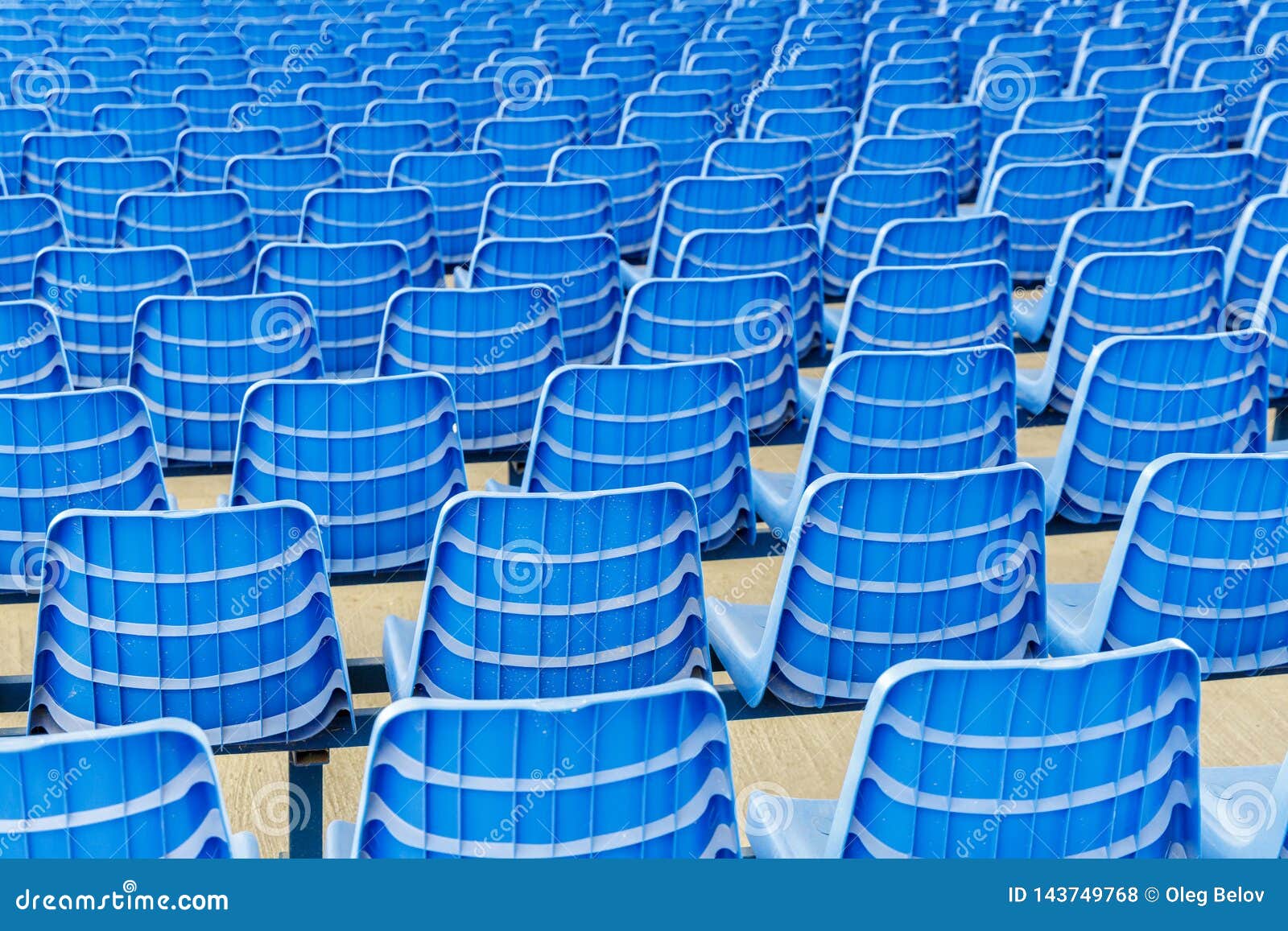 Rows of Blue Plastic Chairs on a Metal Base. Back View Stock Photo ...