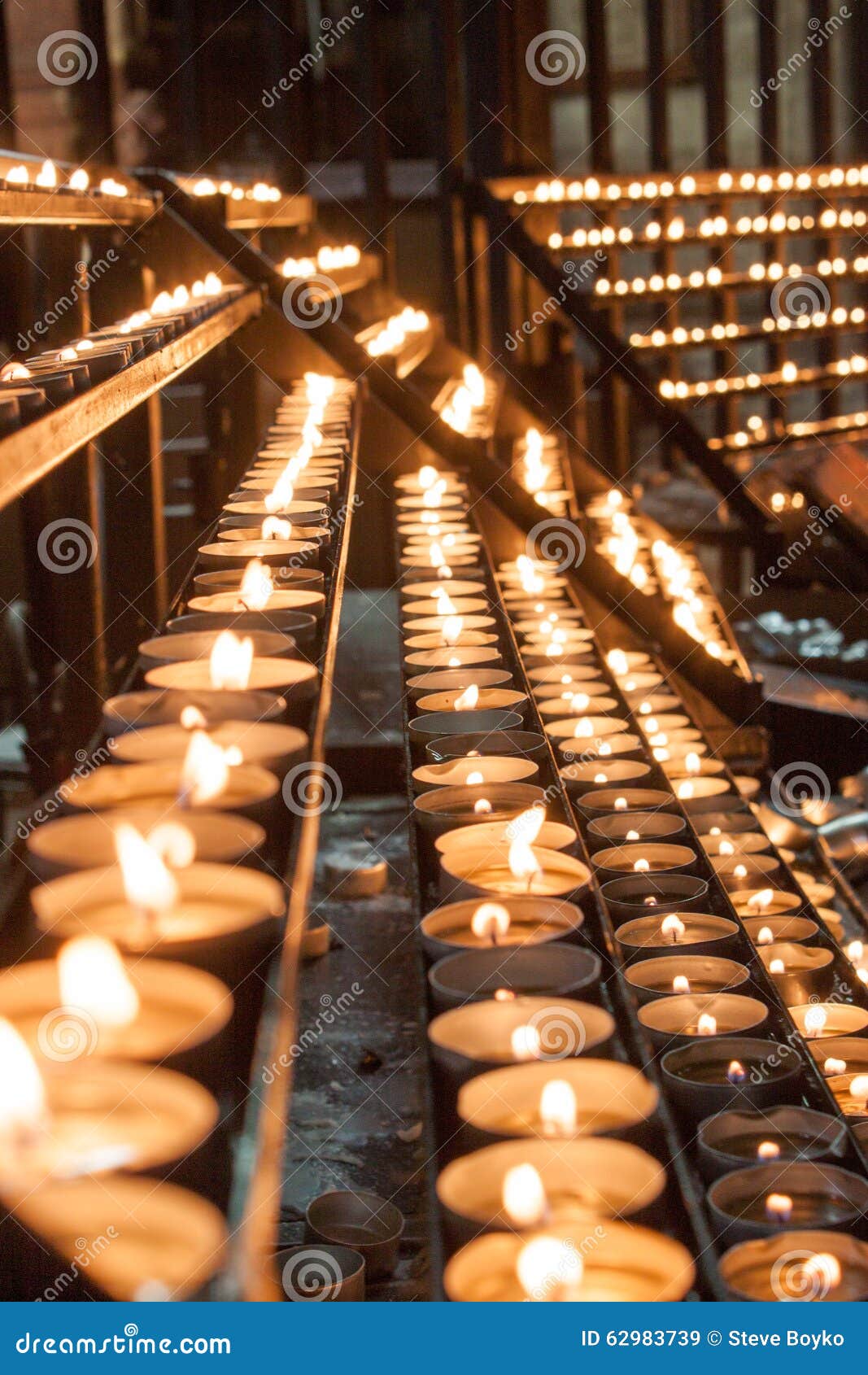 Rows of Burning Candle Offerings in Church Stock Image - Image of ...
