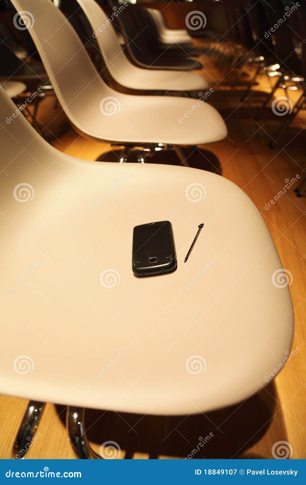 Rows of Chairs; Smartphone on Chair Stock Image - Image of phone ...