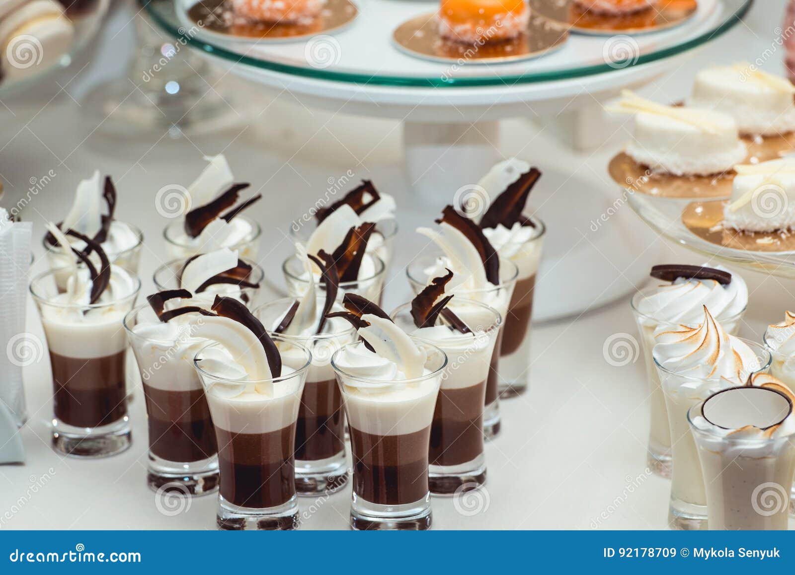 Rows of Chocolate Italian Mignon Cakes on a White Table Stock Image ...