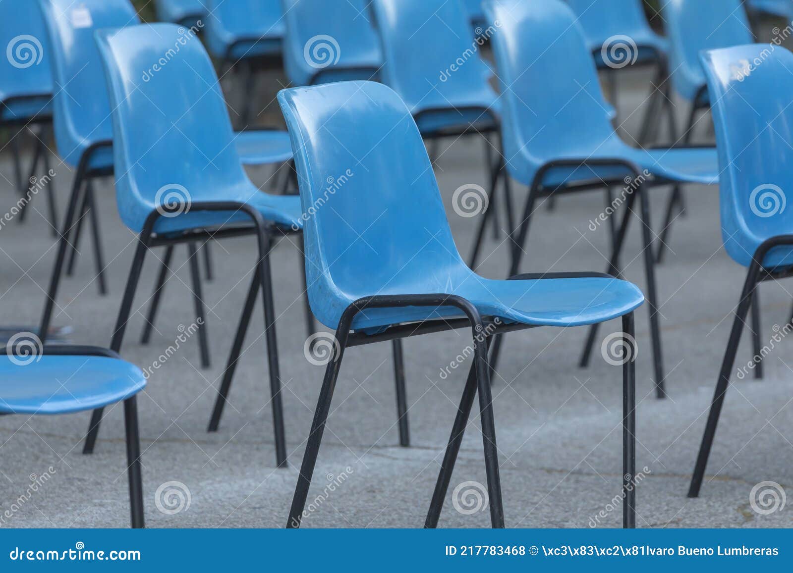 Rows and Columns of Nondescript Blue Plastic Chairs, Spain Stock Photo ...