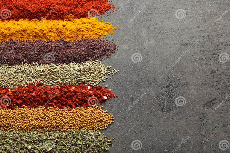 Rows of Different Aromatic Spices on Gray Background Stock Image ...