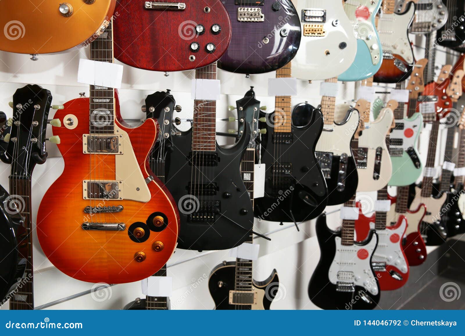 Rows of Guitars in Music Store Stock Photo - Image of hanging ...