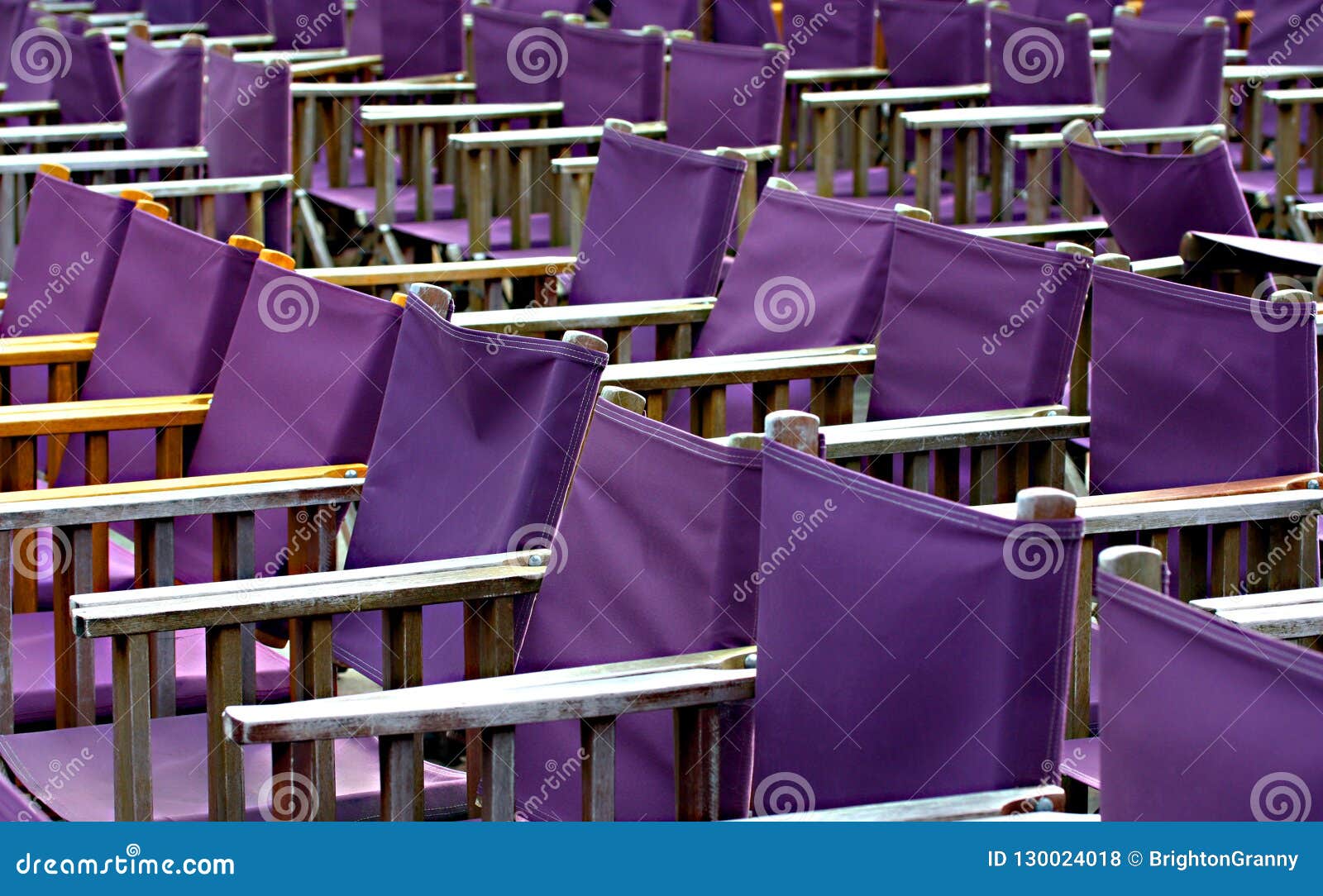 Rows of Fabric Folding Chairs Stock Photo - Image of folded, mauve ...