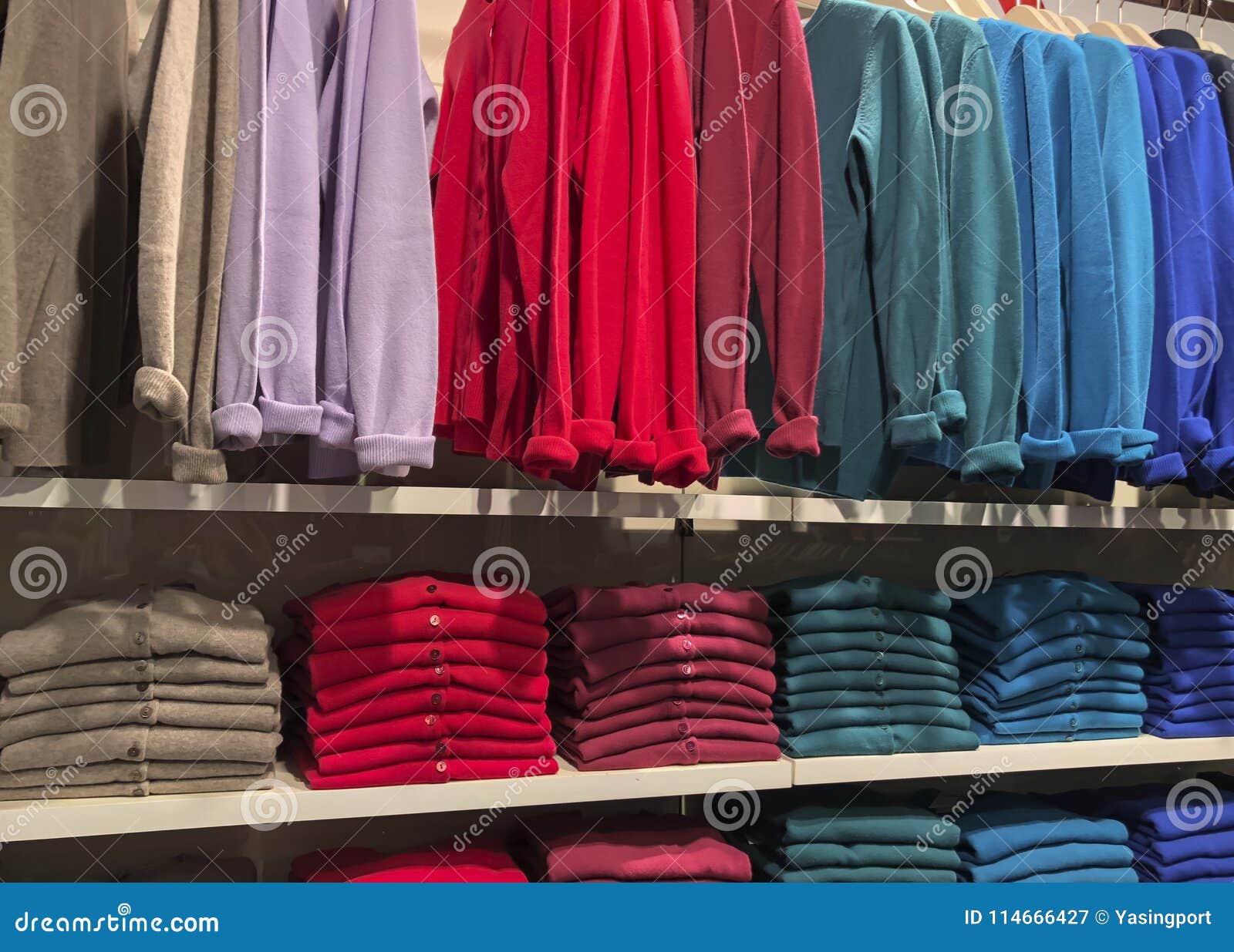 Rows of folded clothes. stock image. Image of colorful - 114666427