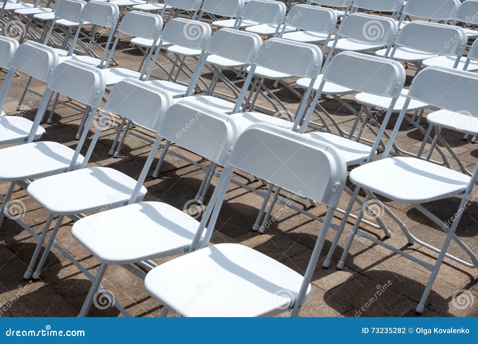 Rows of folding chairs stock photo. Image of business - 73235282