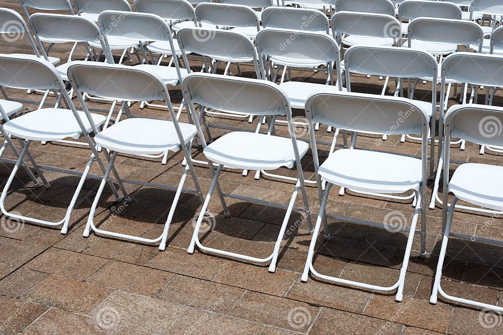 Rows of folding chairs stock photo. Image of furniture - 73235884