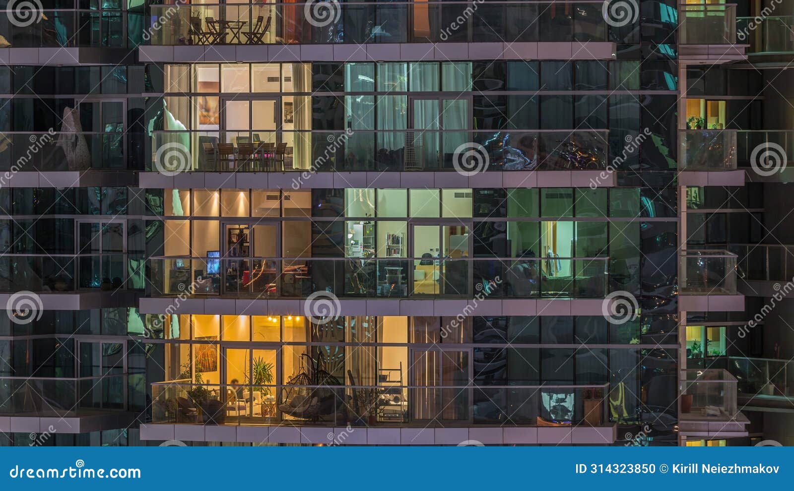 Rows of Glowing Windows with People in Apartment Building at Night ...