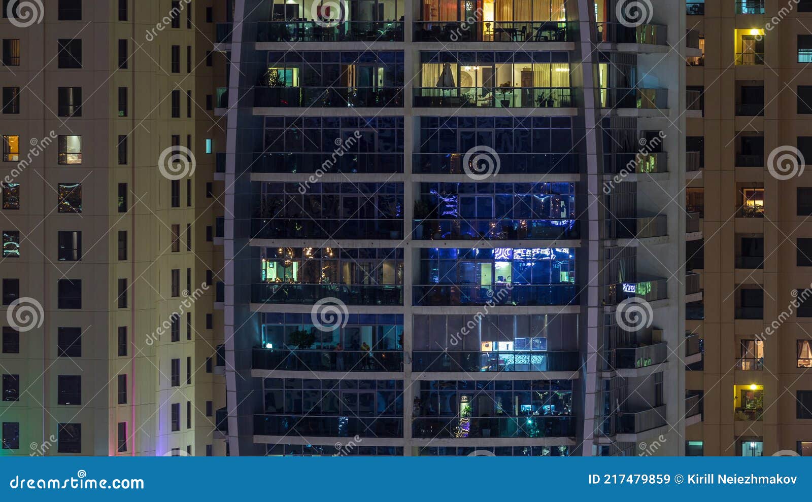 Rows of Glowing Windows with People in Apartment Building at Night ...
