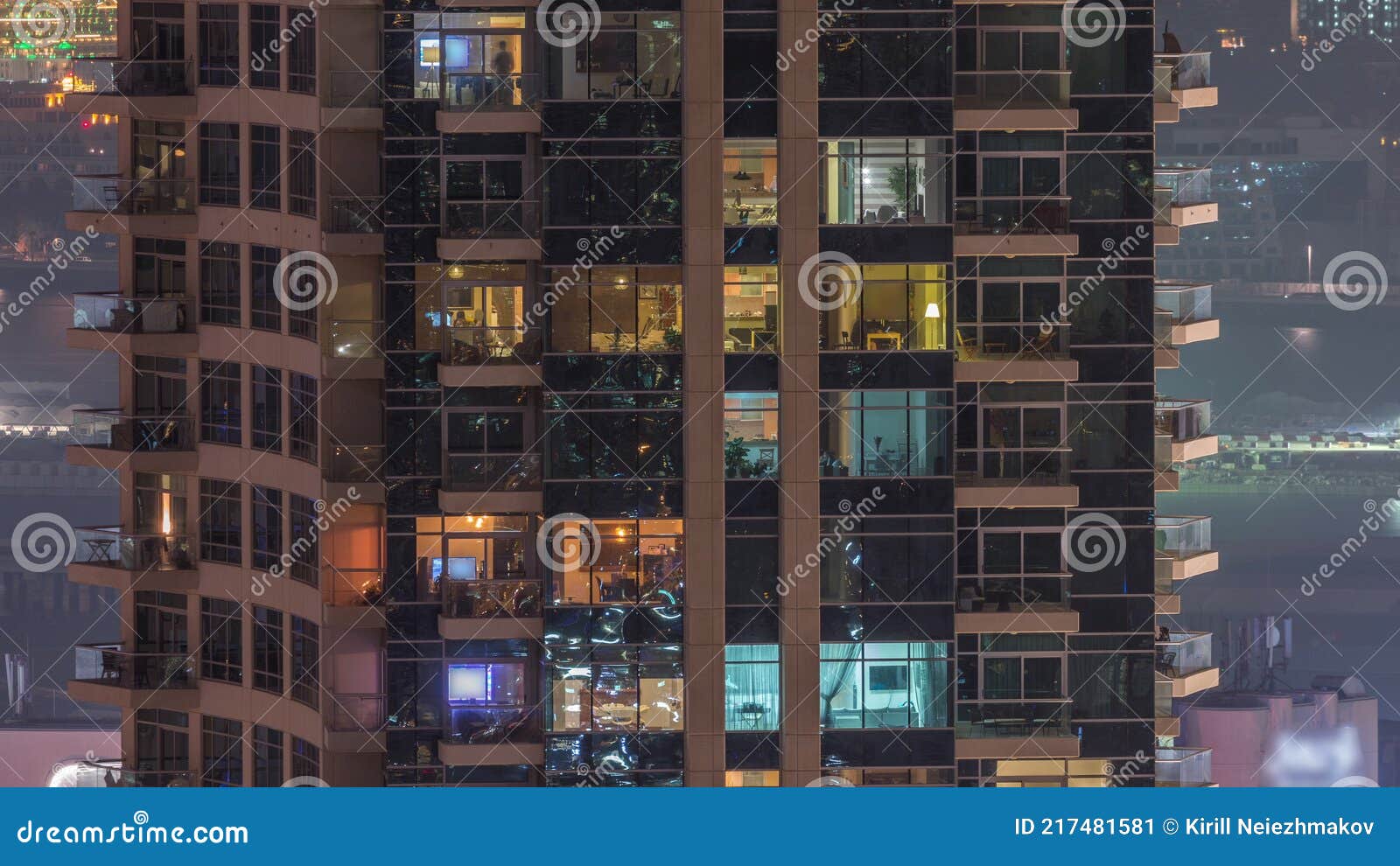 Rows of Glowing Windows with People in Apartment Building at Night ...