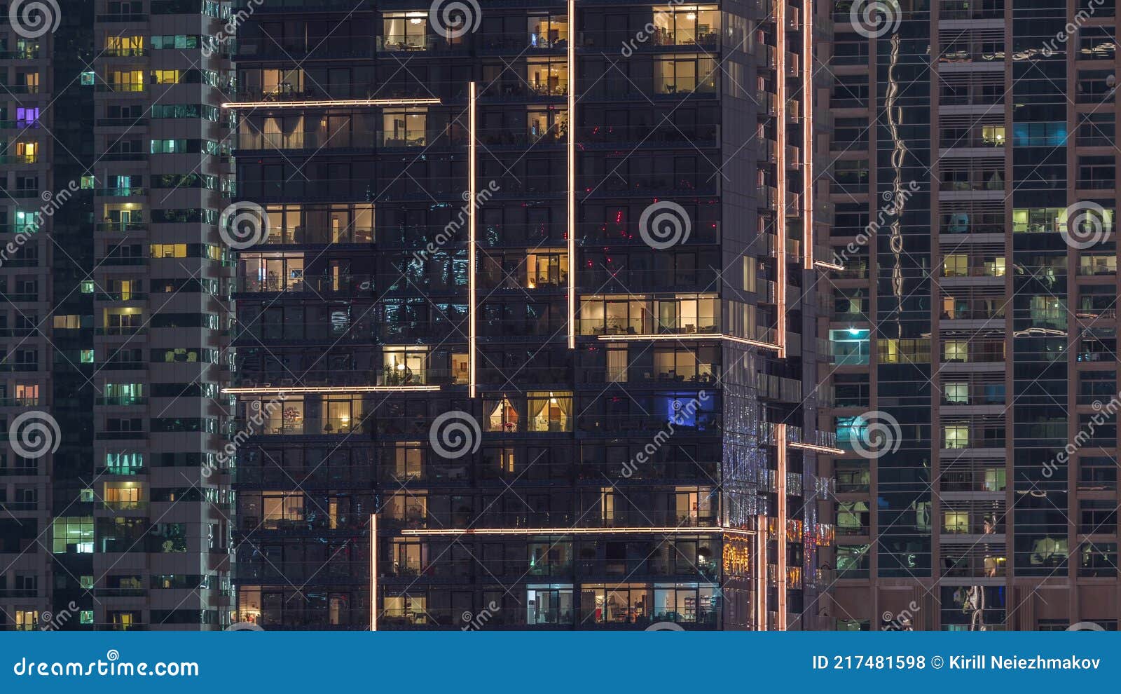 Rows of Glowing Windows with People in Apartment Building at Night ...