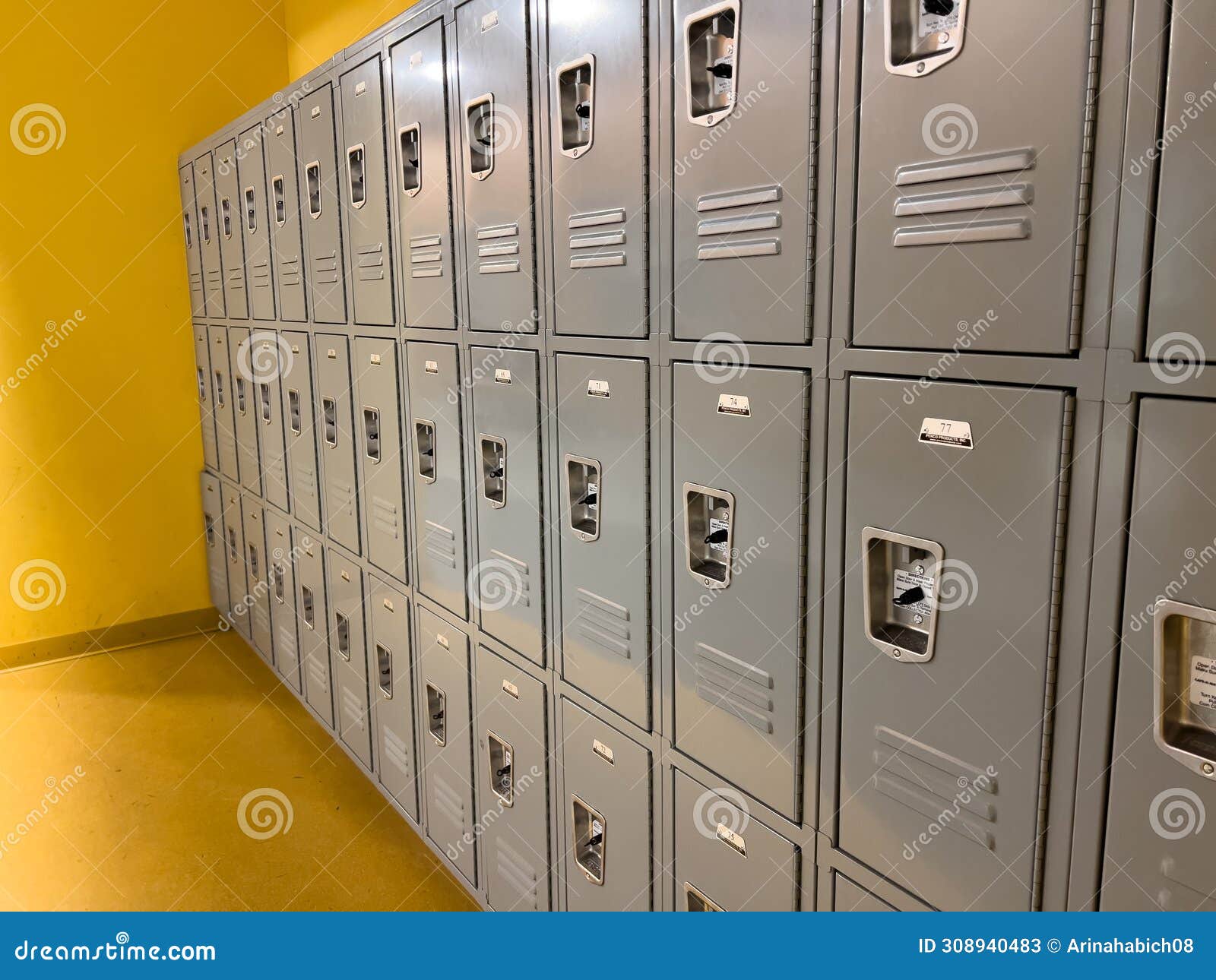 Rows of Gray School Lockers Lined Up Against a Yellow Wall Stock Image ...