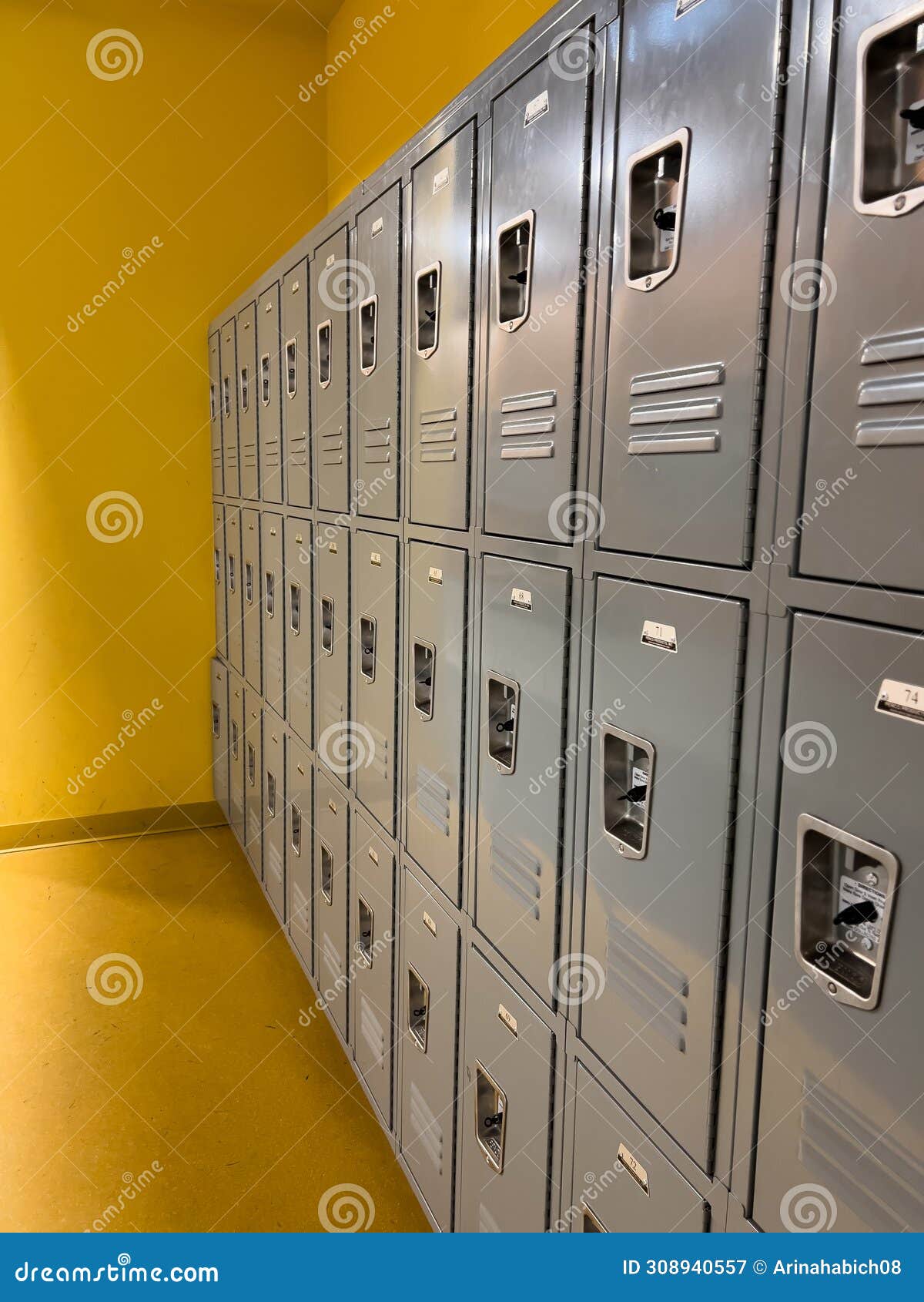 Rows of Gray School Lockers Lined Up Against a Yellow Wall Stock Image ...