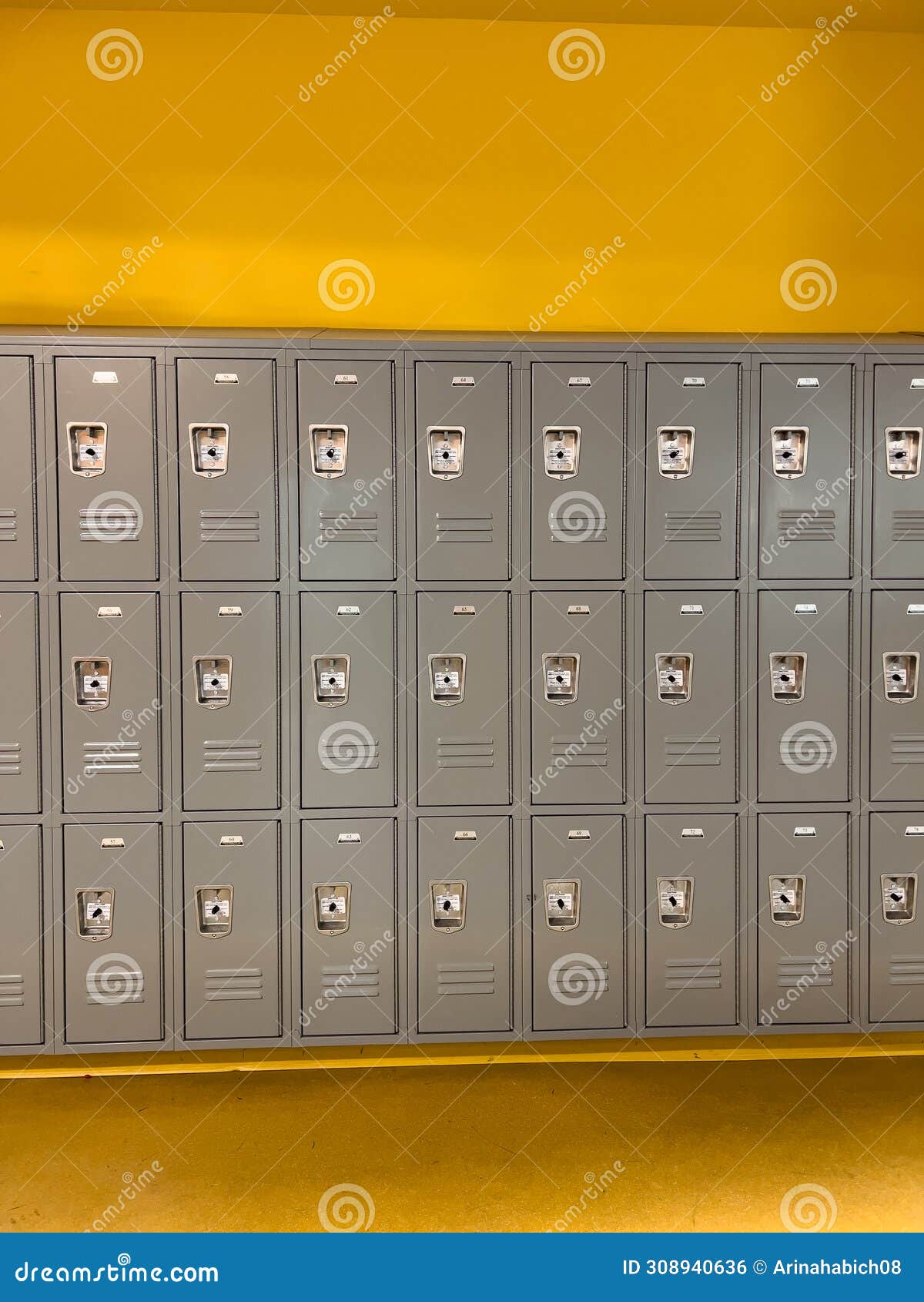 Rows of Gray School Lockers Lined Up Against a Yellow Wall Stock Photo ...