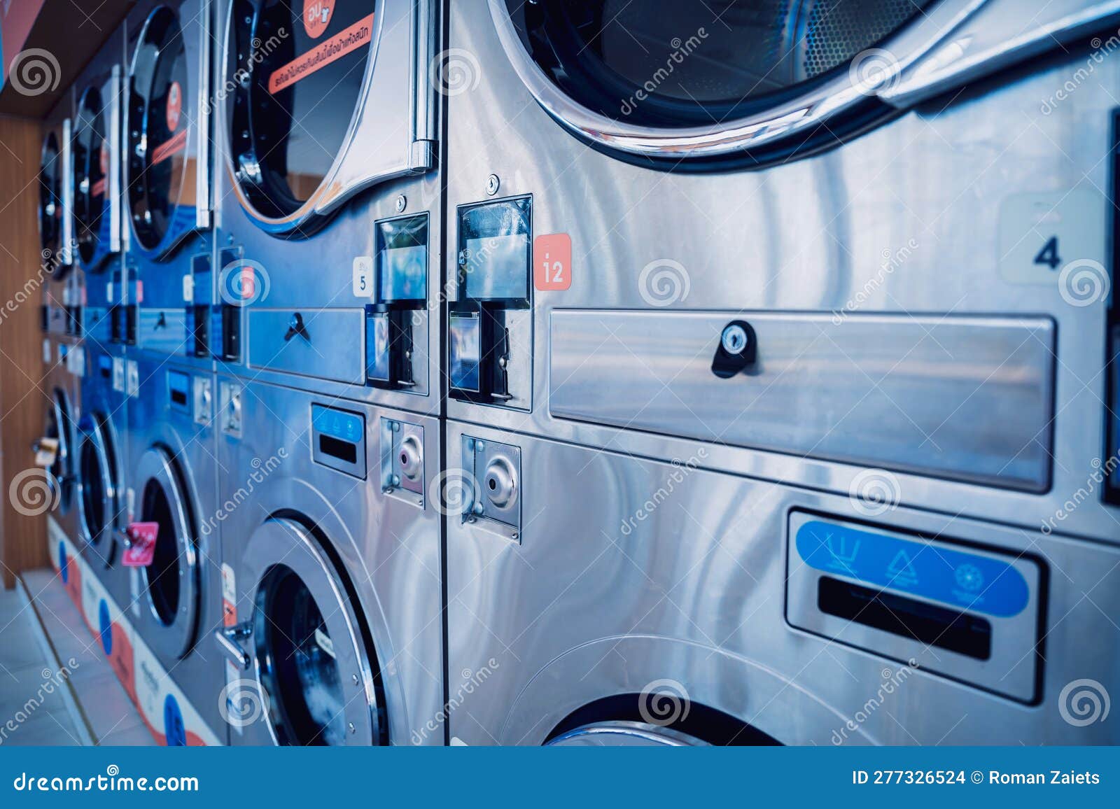 Rows of Industrial Laundry Machines in the Large Laundromat. Stock ...