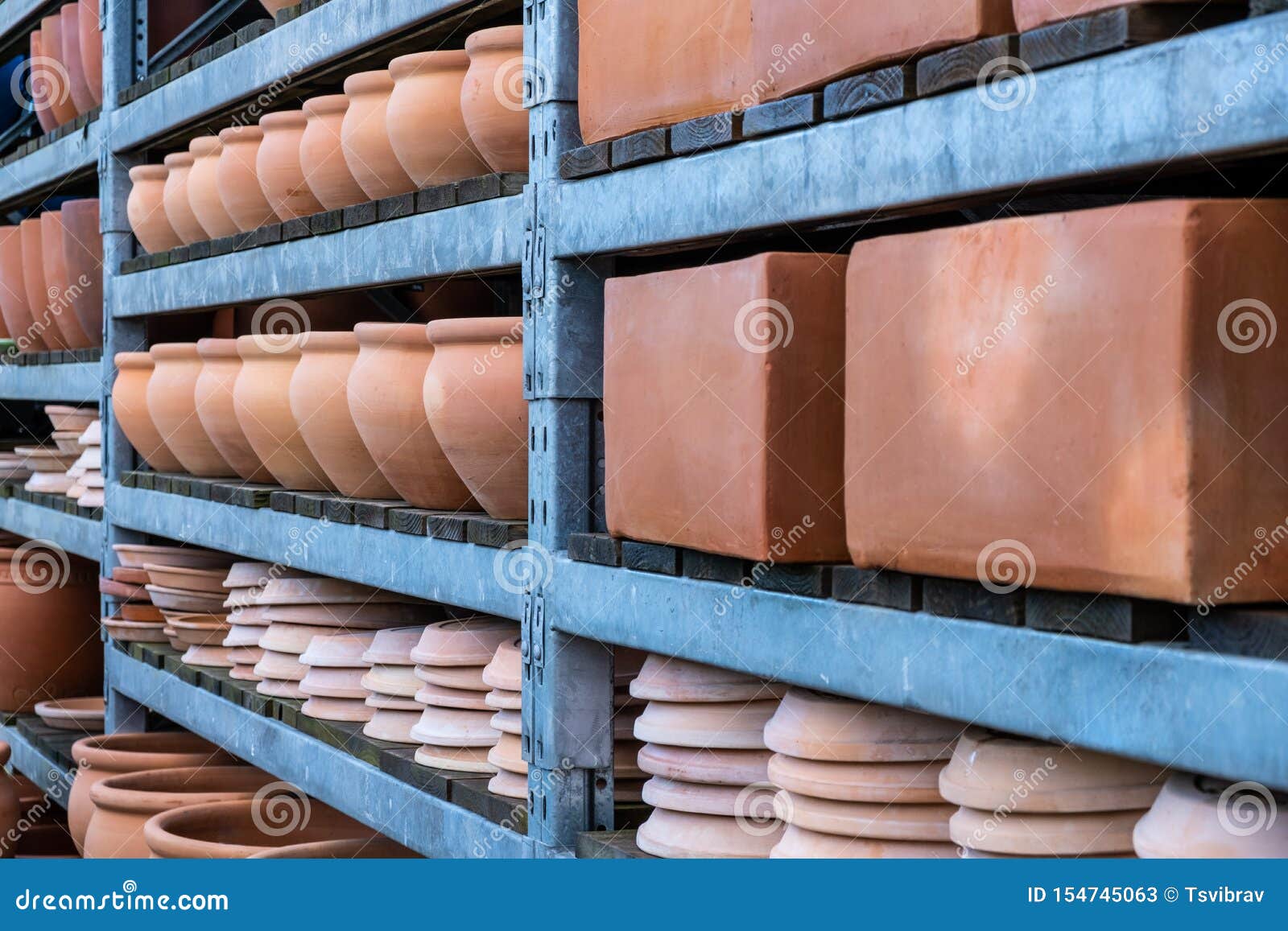 Rows of large flower pots. stock image. Image of design - 154745063