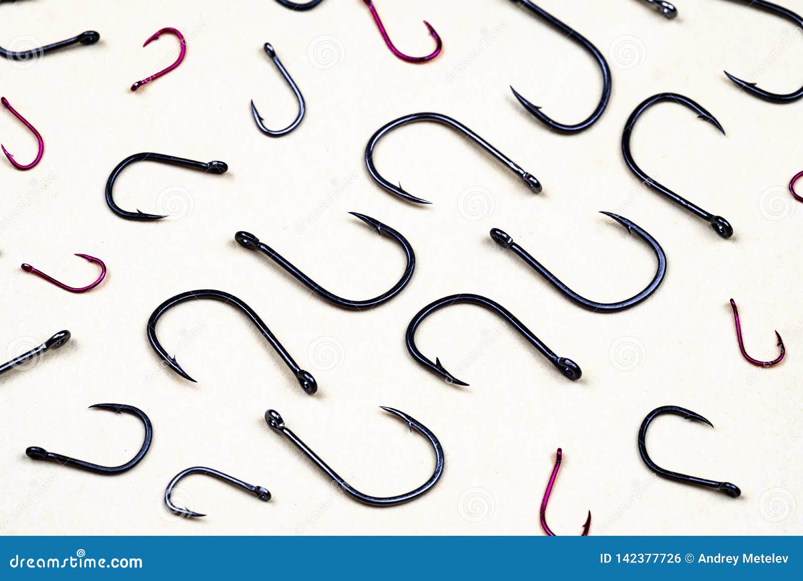 Rows of Large and Small Fishing Hooks of Different Colors Stock Photo ...
