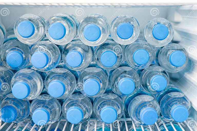 Rows of Many Transparent Plastic Bottles with Drinking Water Supply in ... Rows of Many Transparent Plastic Bottles with Drinking Water Supply in ...