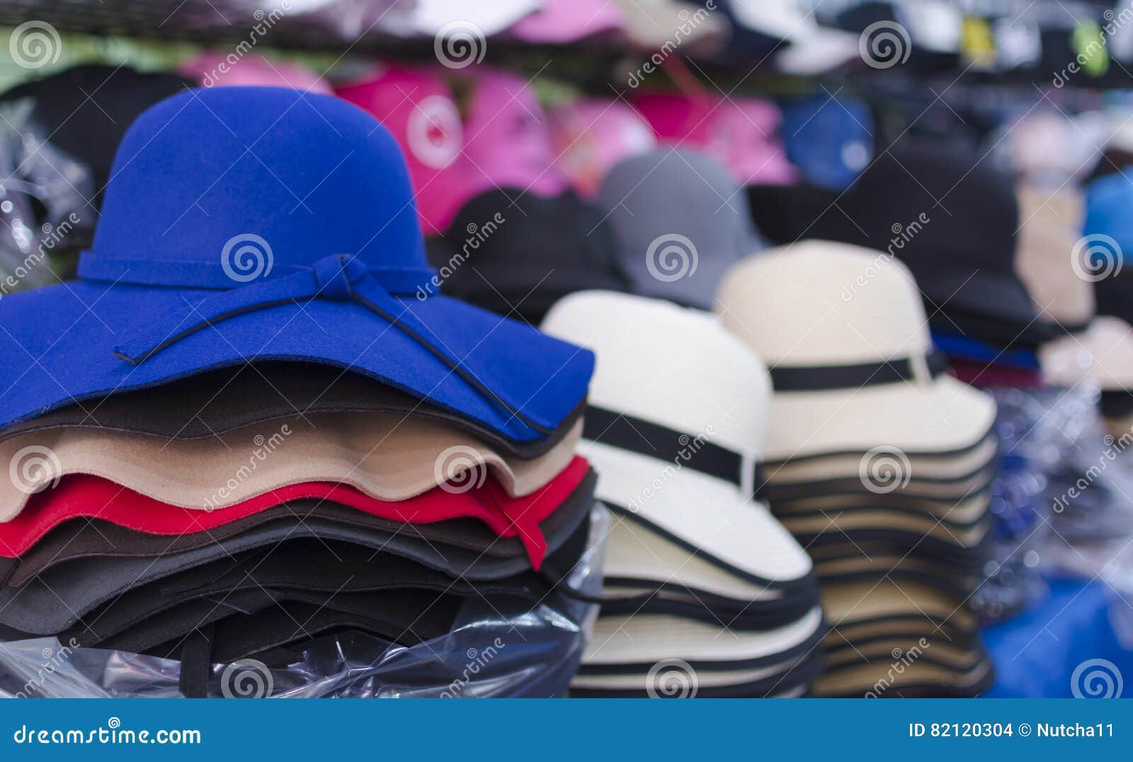 Rows of Multi-colored Straw Hats for Sale on Shelves in a Market Stock ...